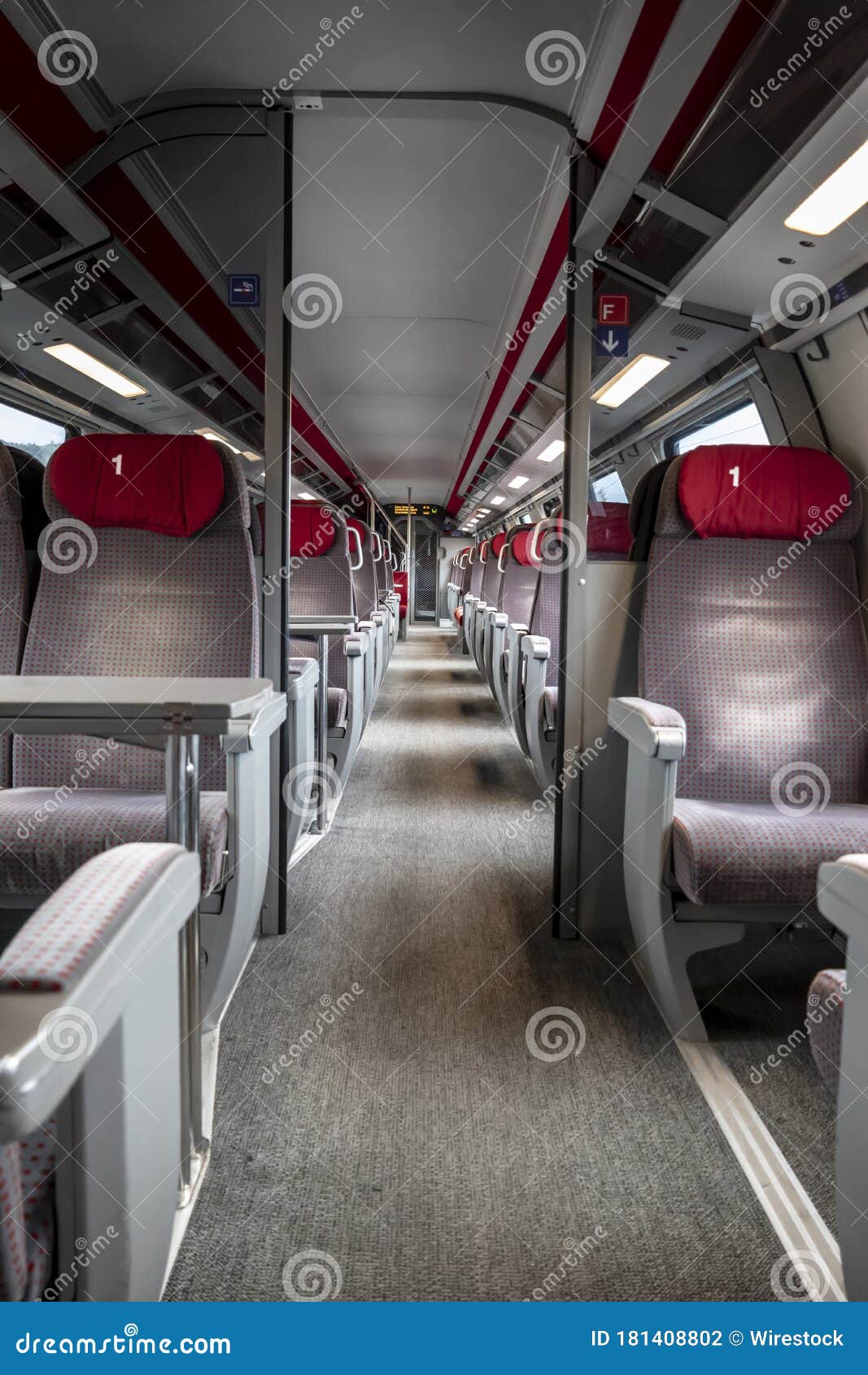 Vertical Shot of the Rows of Red and Grey Seats Inside an Empty Train ...