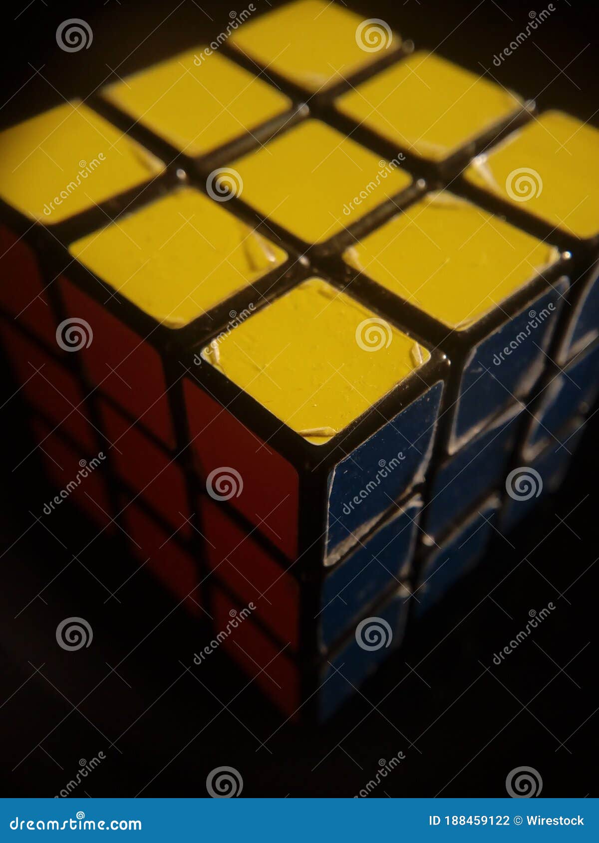 Vertical Shot of Rubik S Cube Isolated on a Black Background Editorial ...