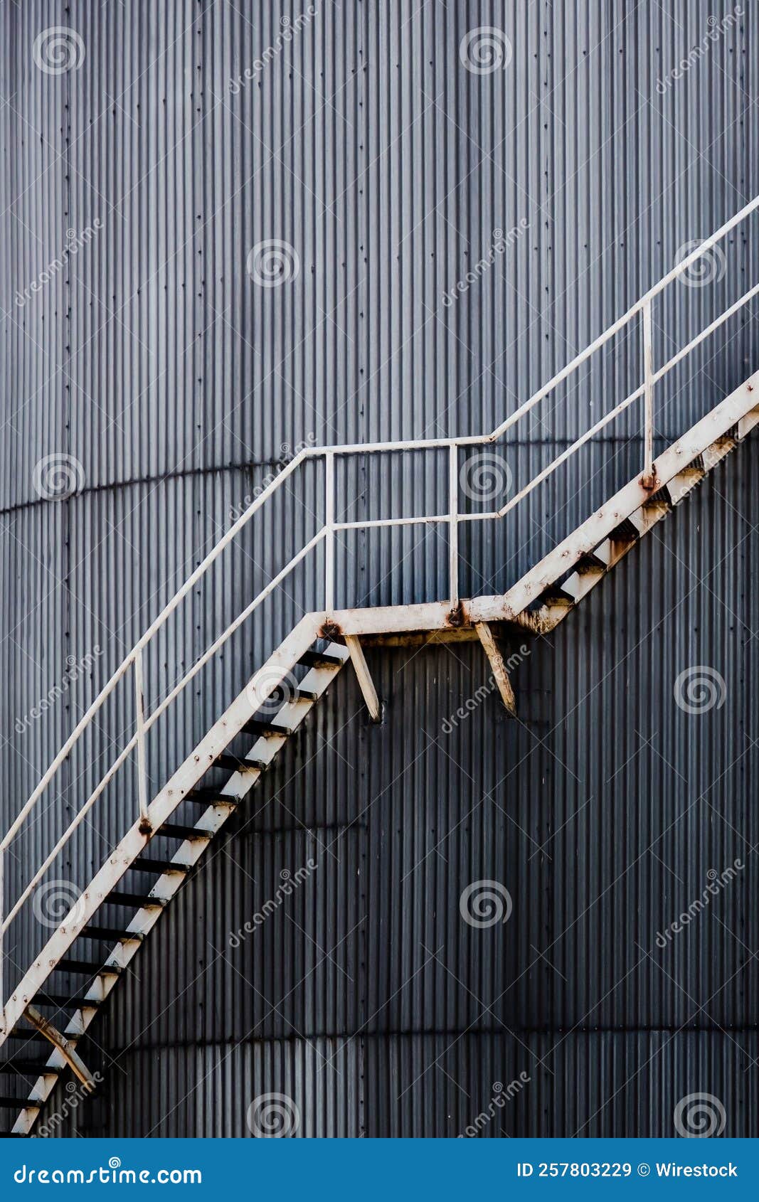 Vertical Shot of Rusty Metal Stairs on the Side of a Metal Building ...