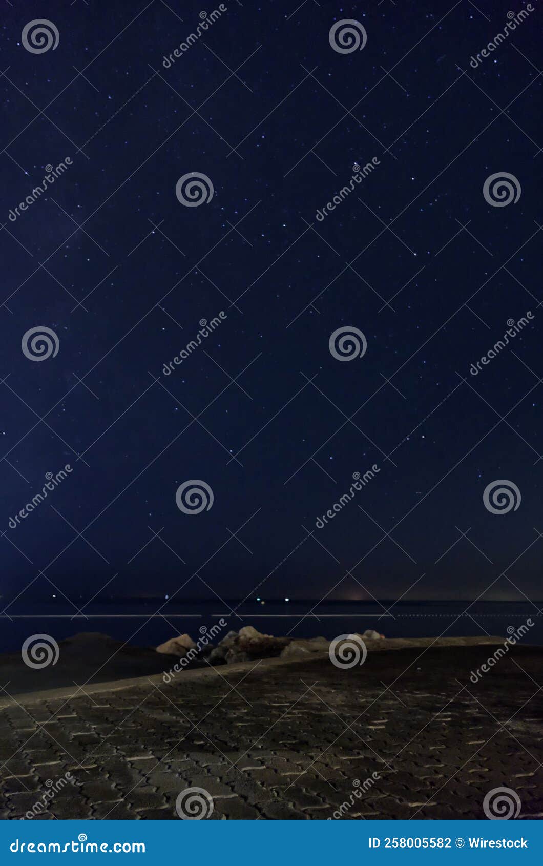 Vertical Shot of a Sea at Starry Night Stock Photo - Image of light ...