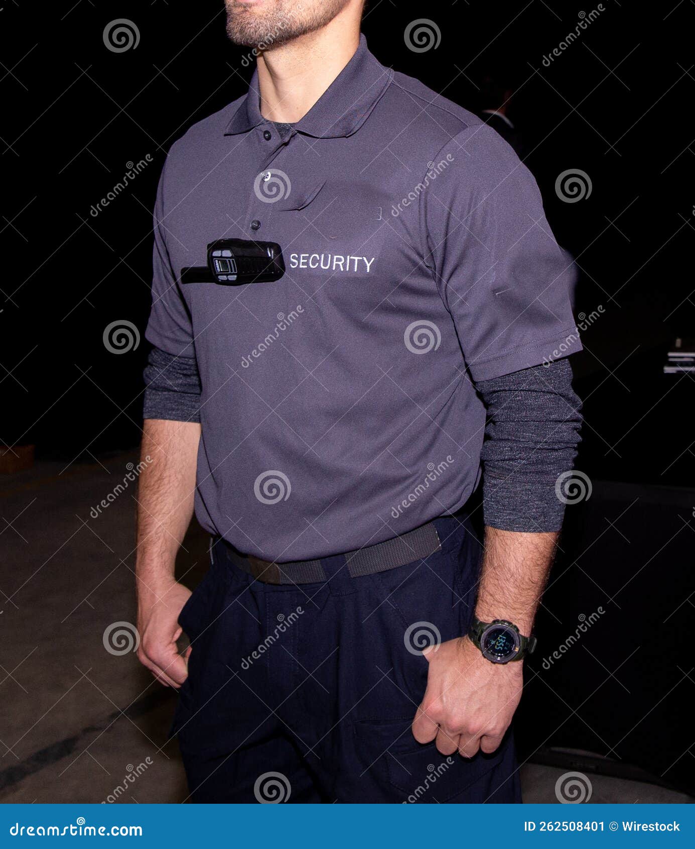Vertical Shot of a Security Guard in Uniform Patrolling in a Commercial ...