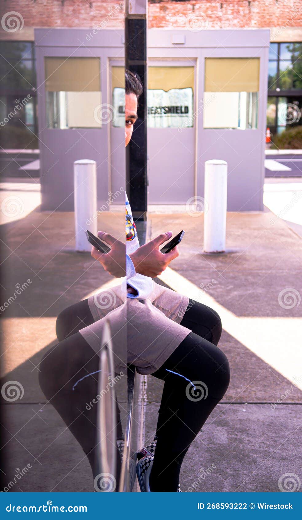 Vertical Shot of Self-reflection of a Man at Sacramento Downtown ... Vertical Shot of Self-reflection of a Man at Sacramento Downtown ...