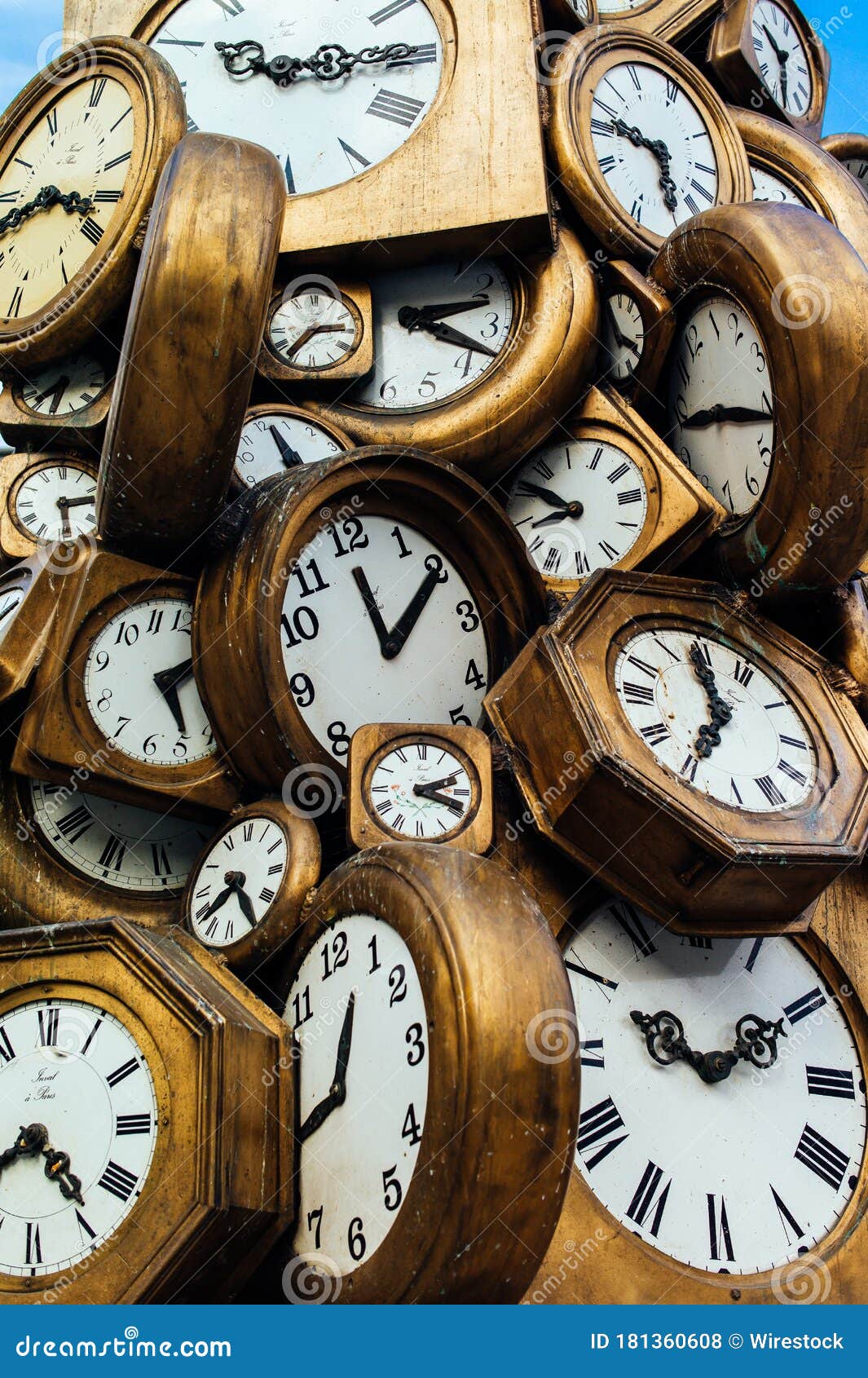 Vertical Shot of Several Clocks on Top of Each Other Stock Photo ...