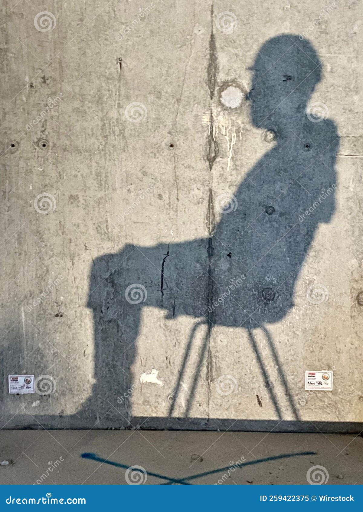 Vertical Shot of a Shadow of a Construction Worker Sitting on a Chair ...