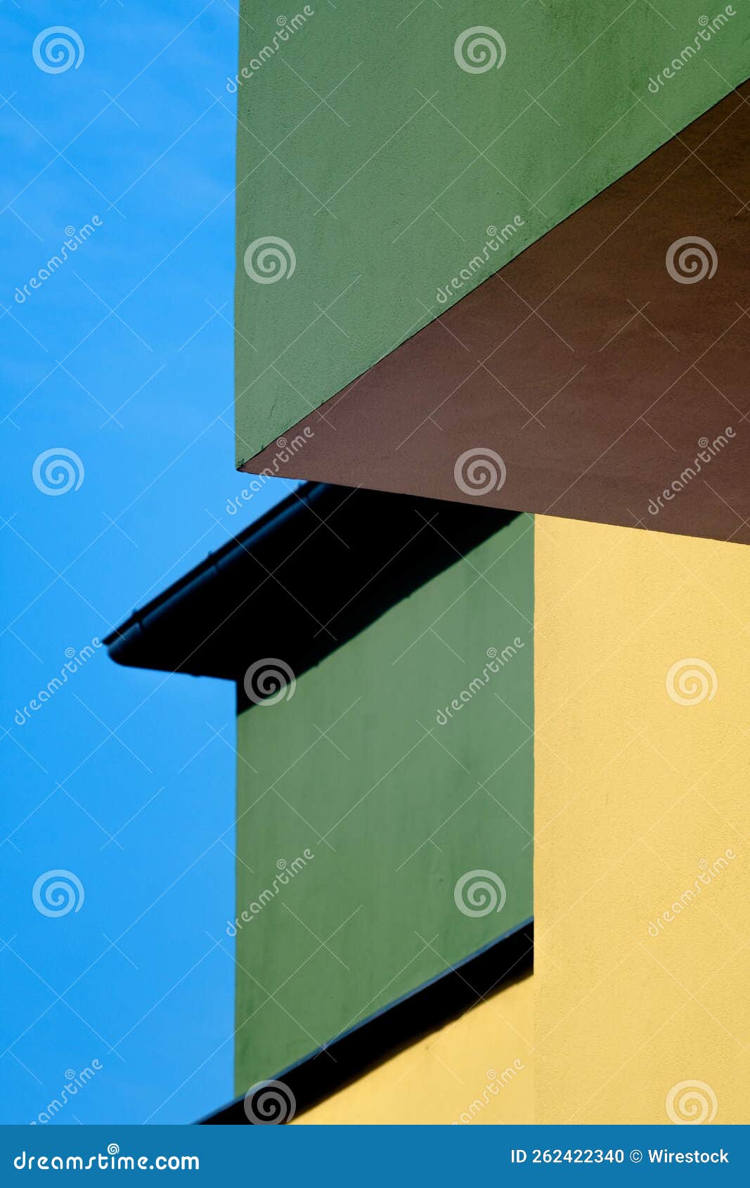 Vertical Shot of the Sharp Angles of a Building, Yellow and Green ...