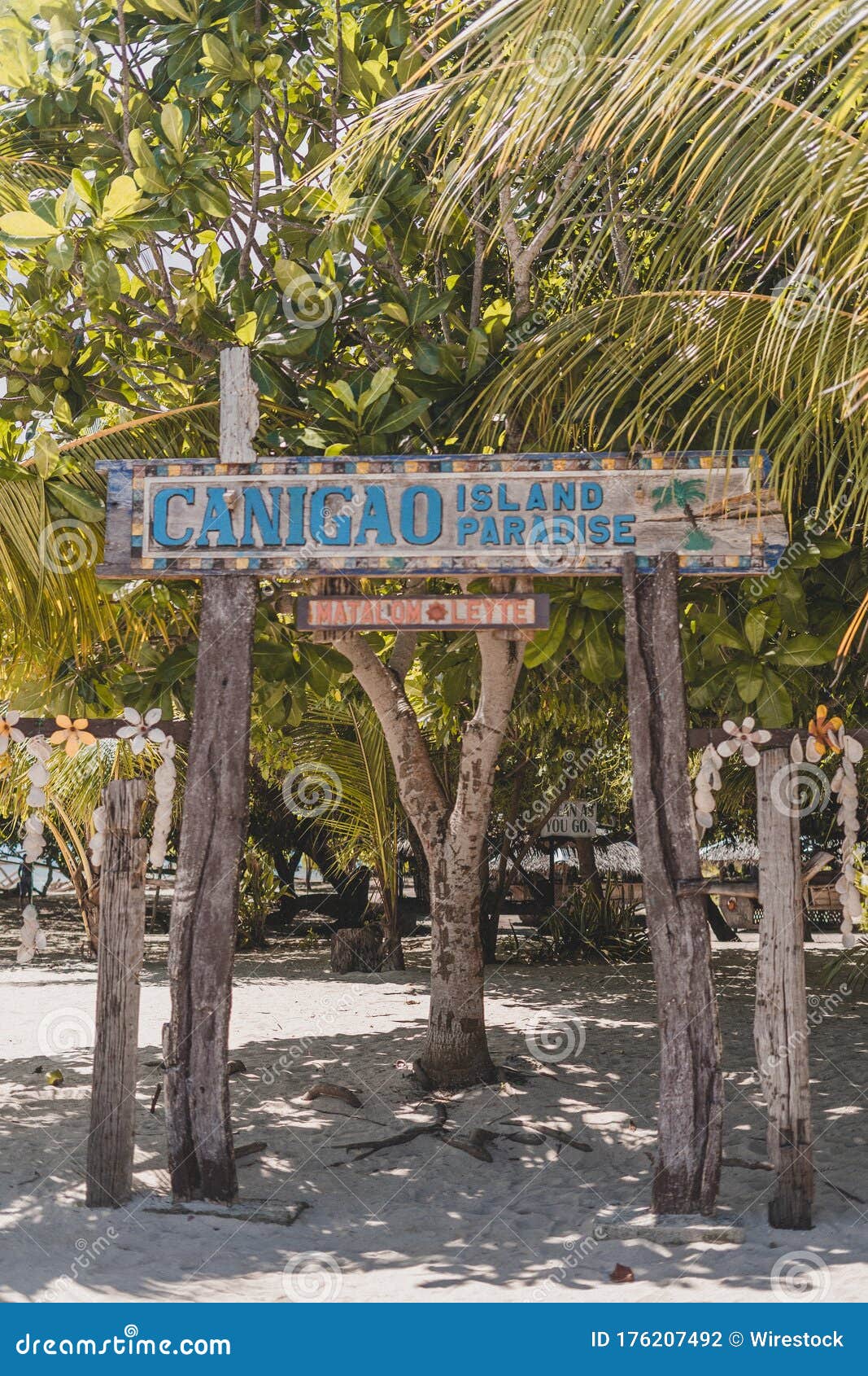 Vertical Shot of a Sign of Island Paradise Under the Trees Editorial ...