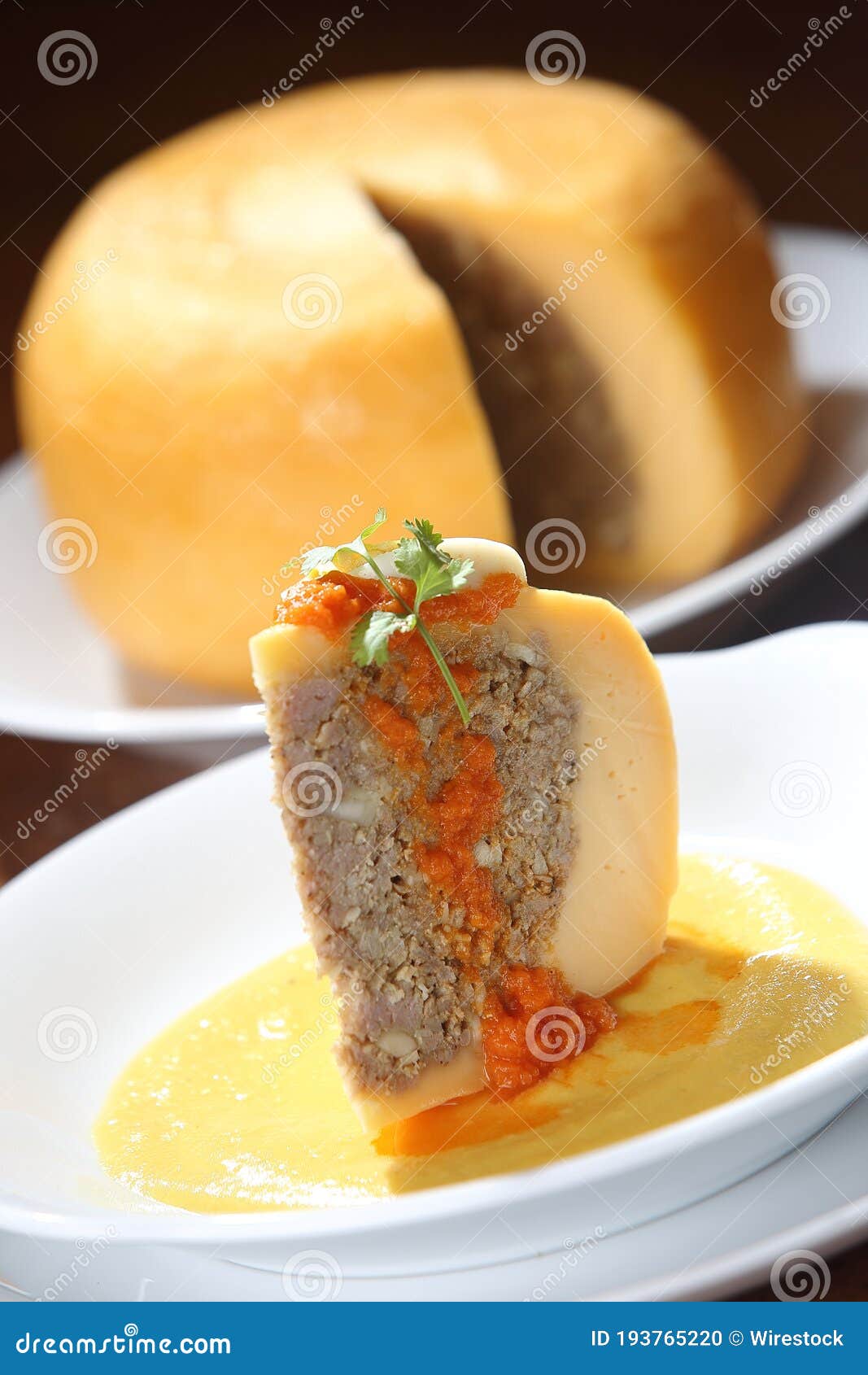 Vertical Shot of a Slice of Edam Cheese Stuffed with Beef and Tomato ...