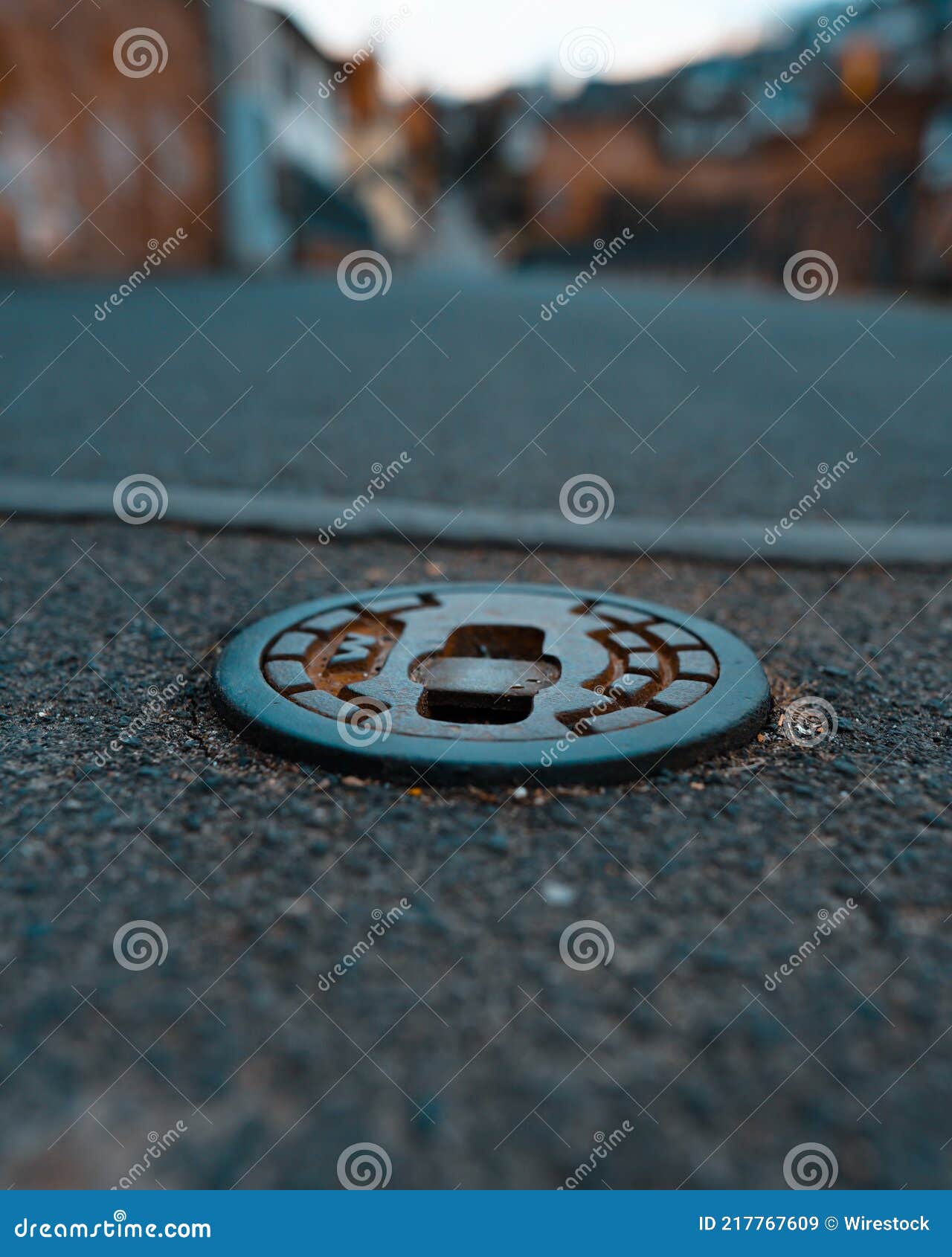 Vertical Shot of a Small Manhole in the Street Stock Image - Image of ...