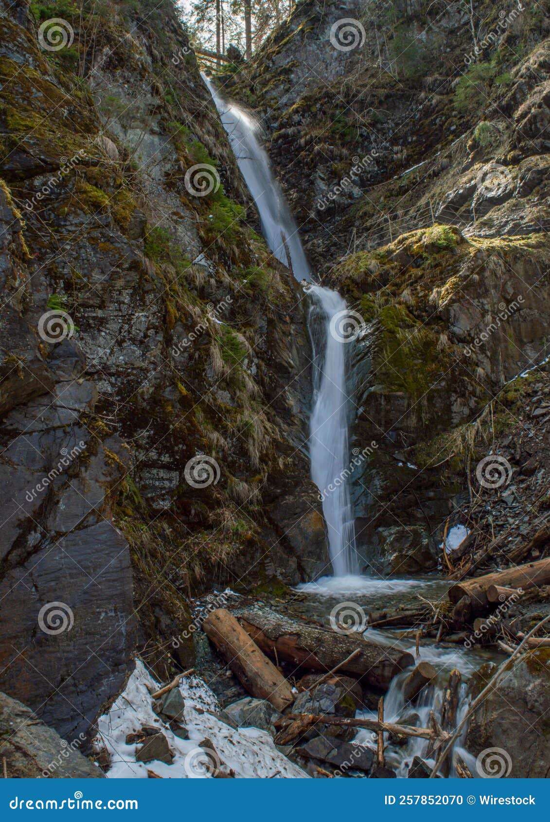 Vertical Shot of a Small Waterfall in the Mountains Stock Photo - Image ...