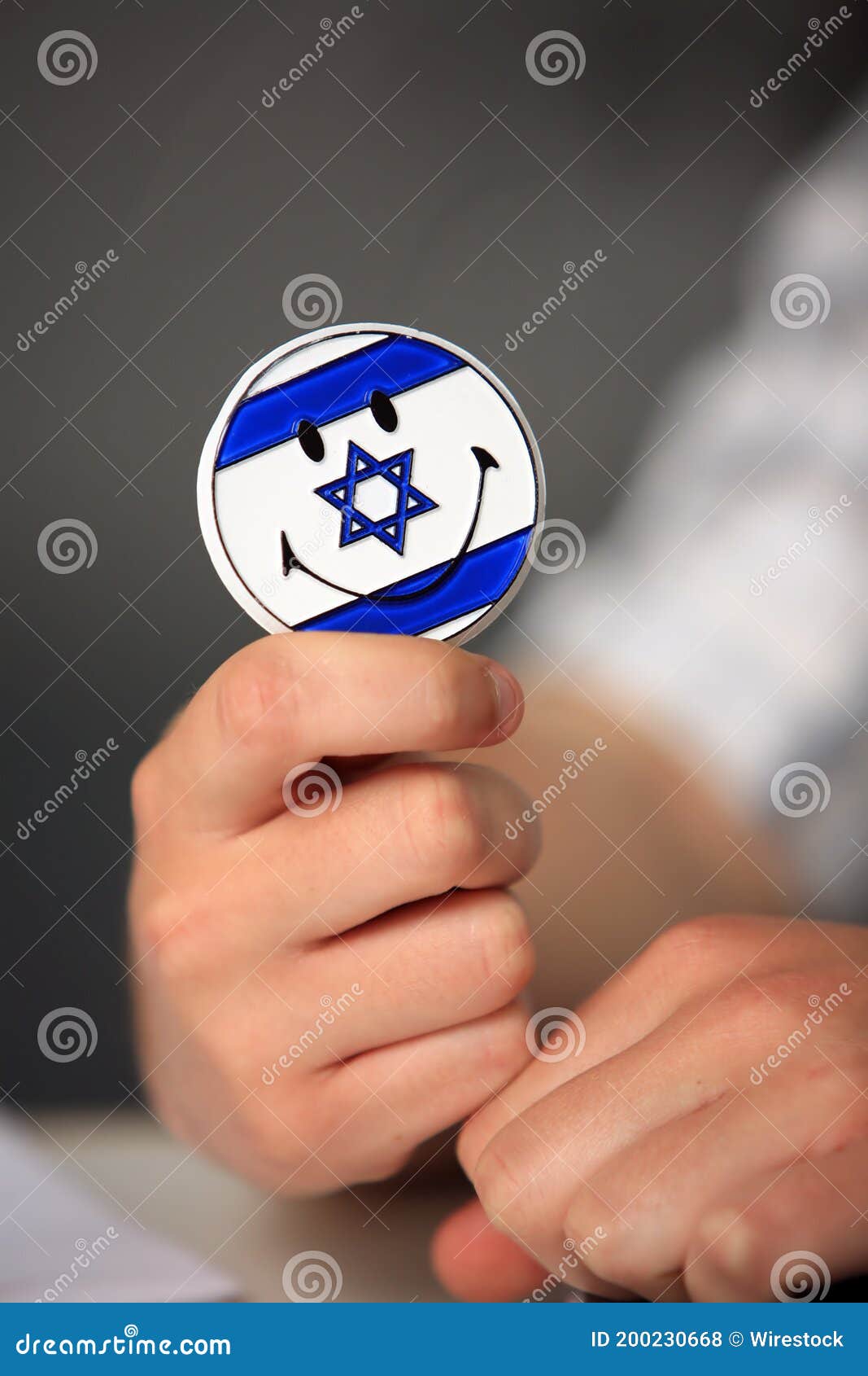 Vertical Shot of a Smiling Sticker in a Human Hand with Israel Flag ...
