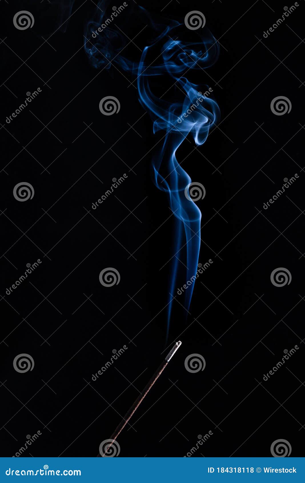 Vertical Shot of Smoke with Blue Light Effects Isolated on a Black ...
