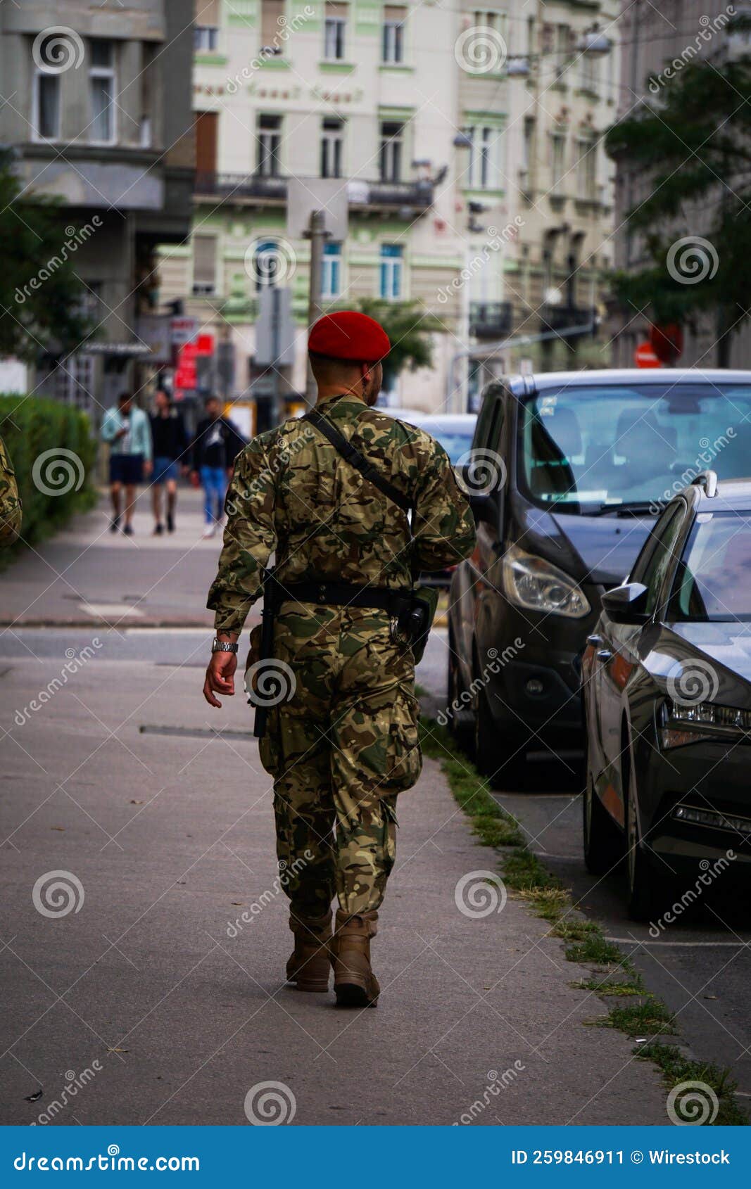 Vertical Shot of a Soldier Walking on the Street Editorial Photo ...