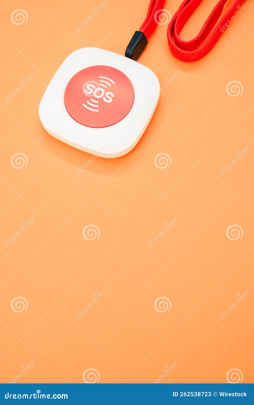 Vertical Shot of an SOS Button on a String, Placed on an Orange Surface ...