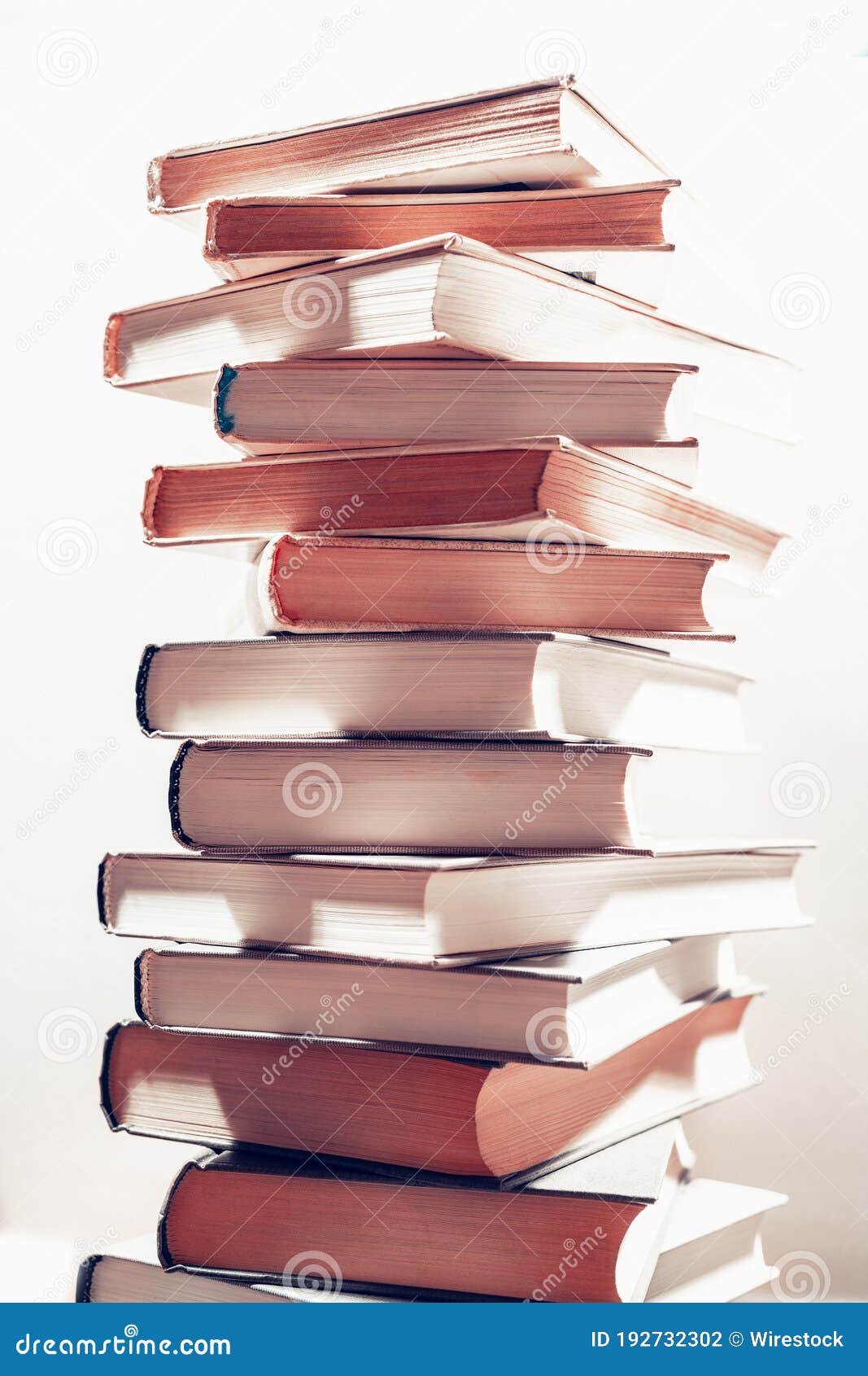 Vertical Shot of a Stack of Books Isolated on a White Background Stock ...