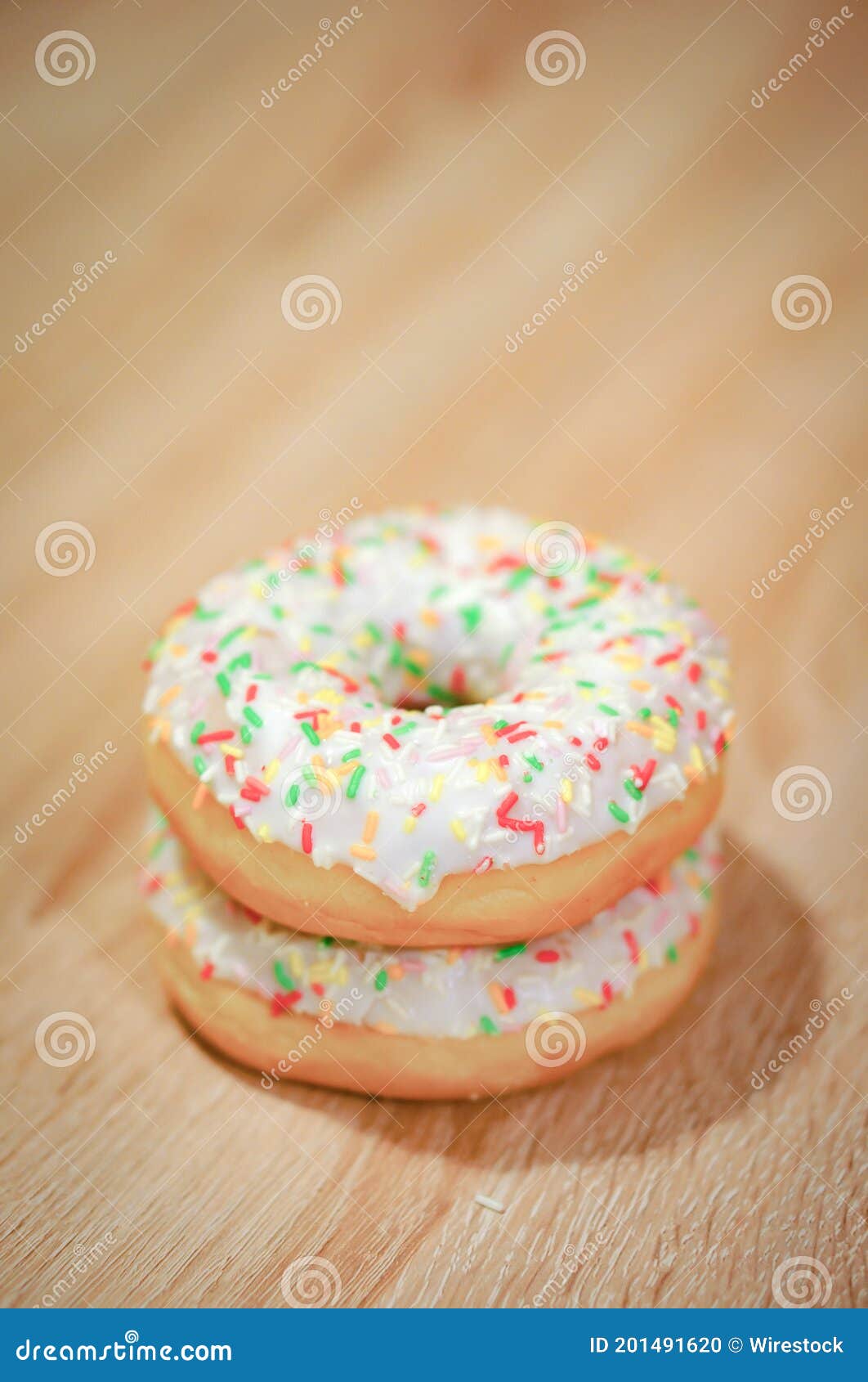 Vertical Shot of a Stack of Sweet Donuts with Vanilla Icing and ...