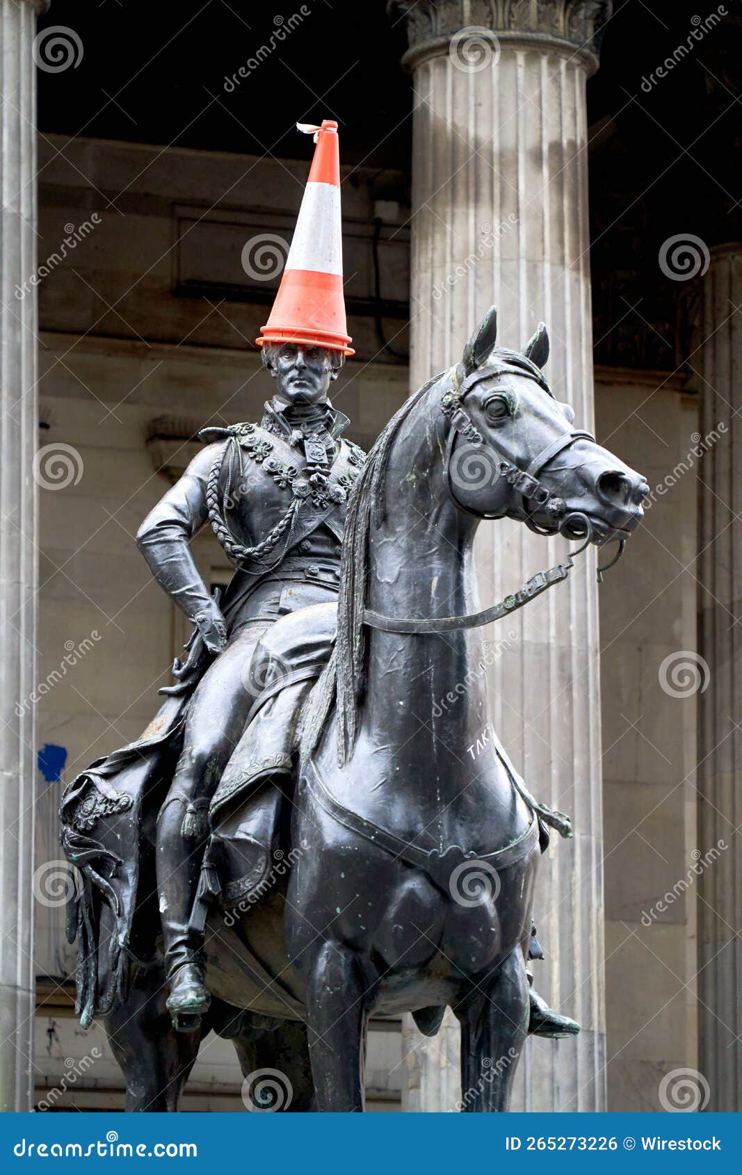 Vertical Shot of the Statue of the Duke of Wellington with a Traffic ...