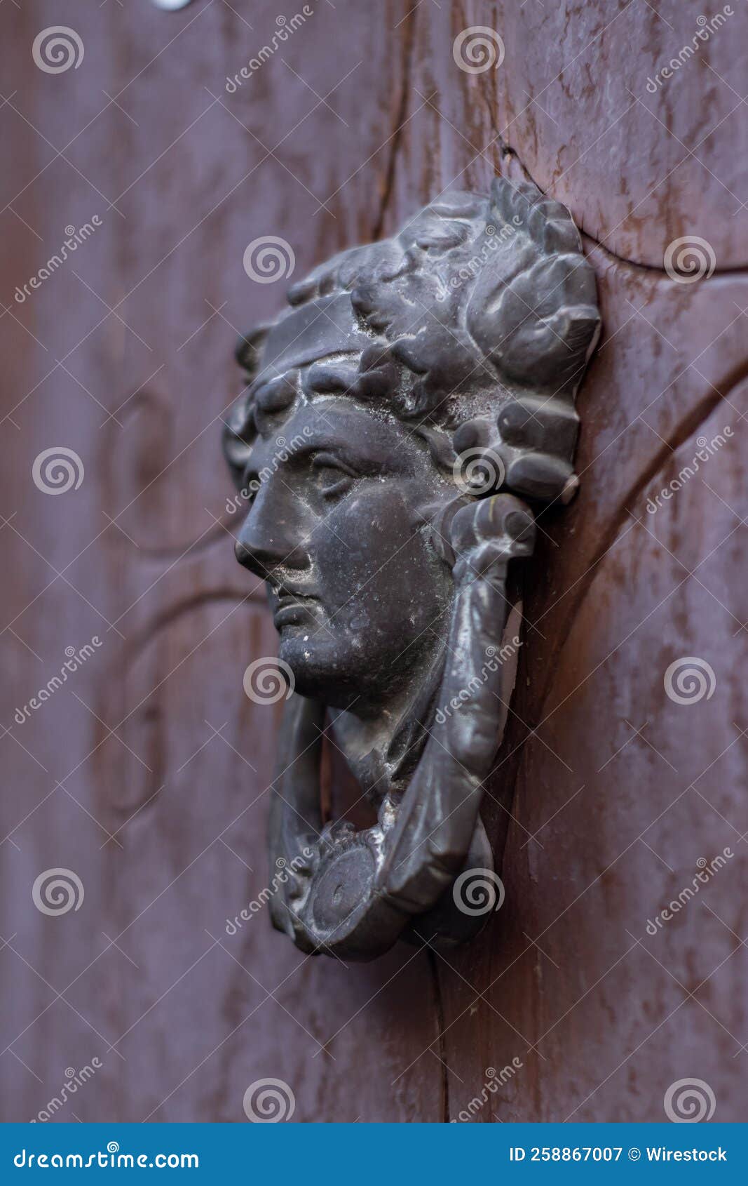 Vertical Shot of a Stone Statue Face on the Wall Stock Image - Image of ...