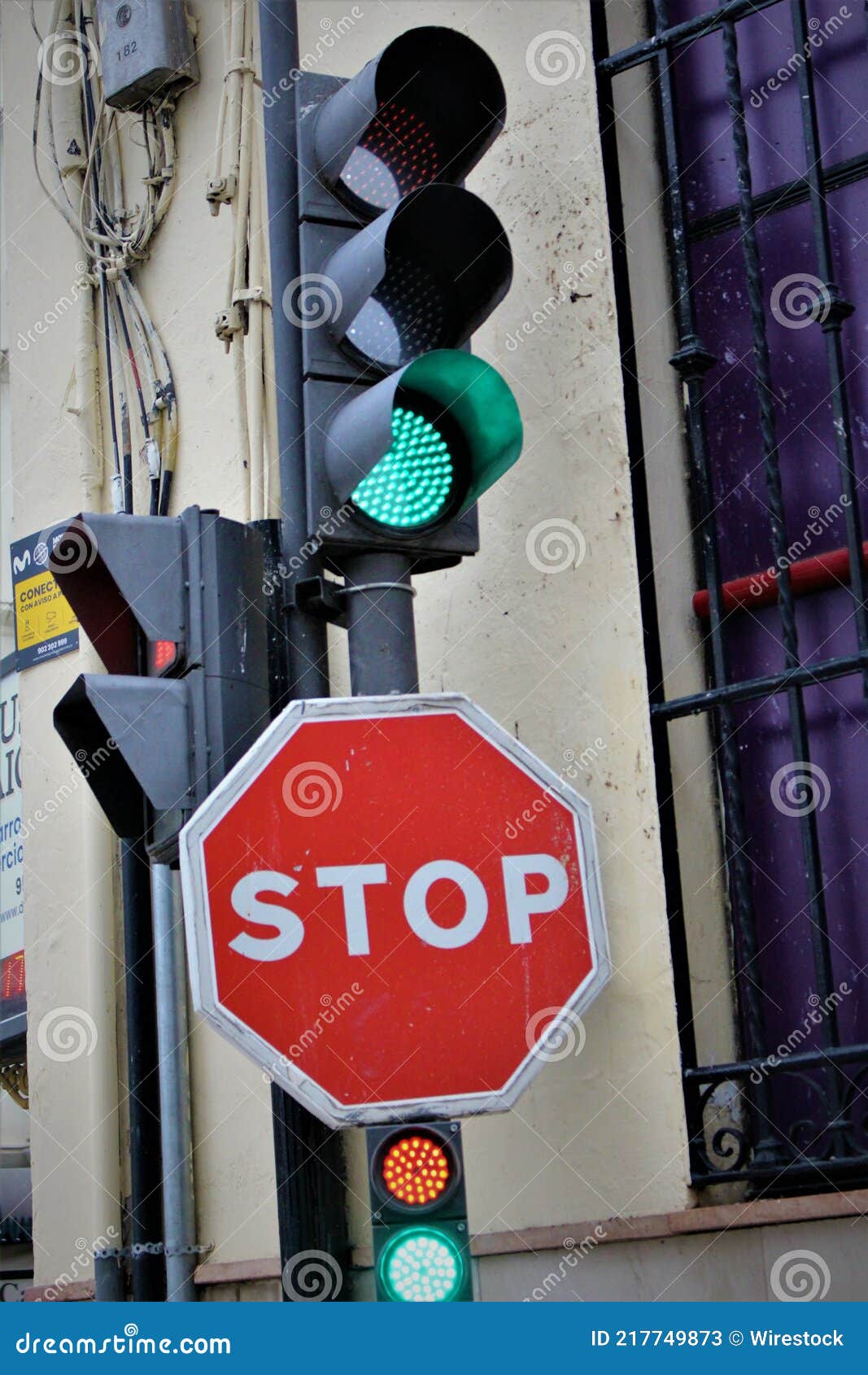 Vertical Shot of a Stop Sign on the Street Below the Traffic Lights ...