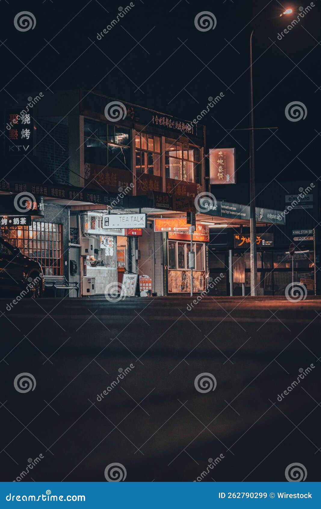 Vertical Shot of the Street View of Stores at Night Editorial Stock ...