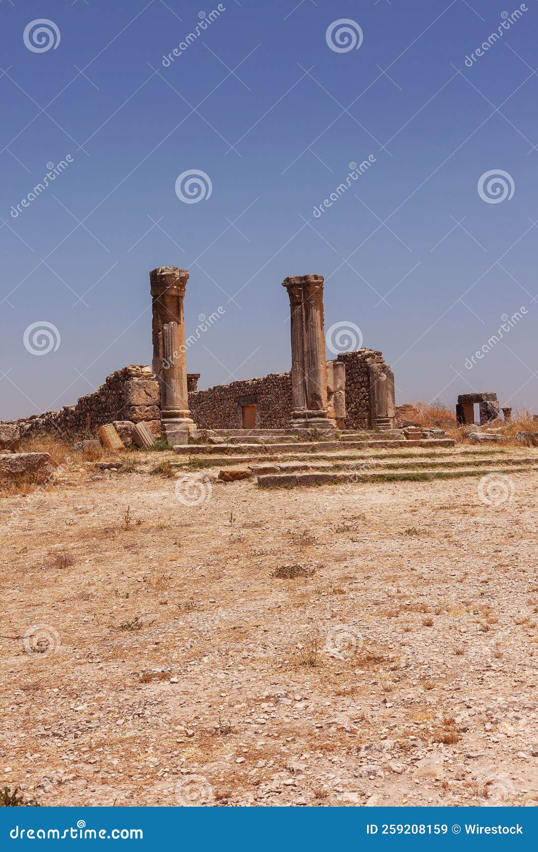 Vertical Shot of a Structure Built in Volubilis City Under a Clear Blue ...