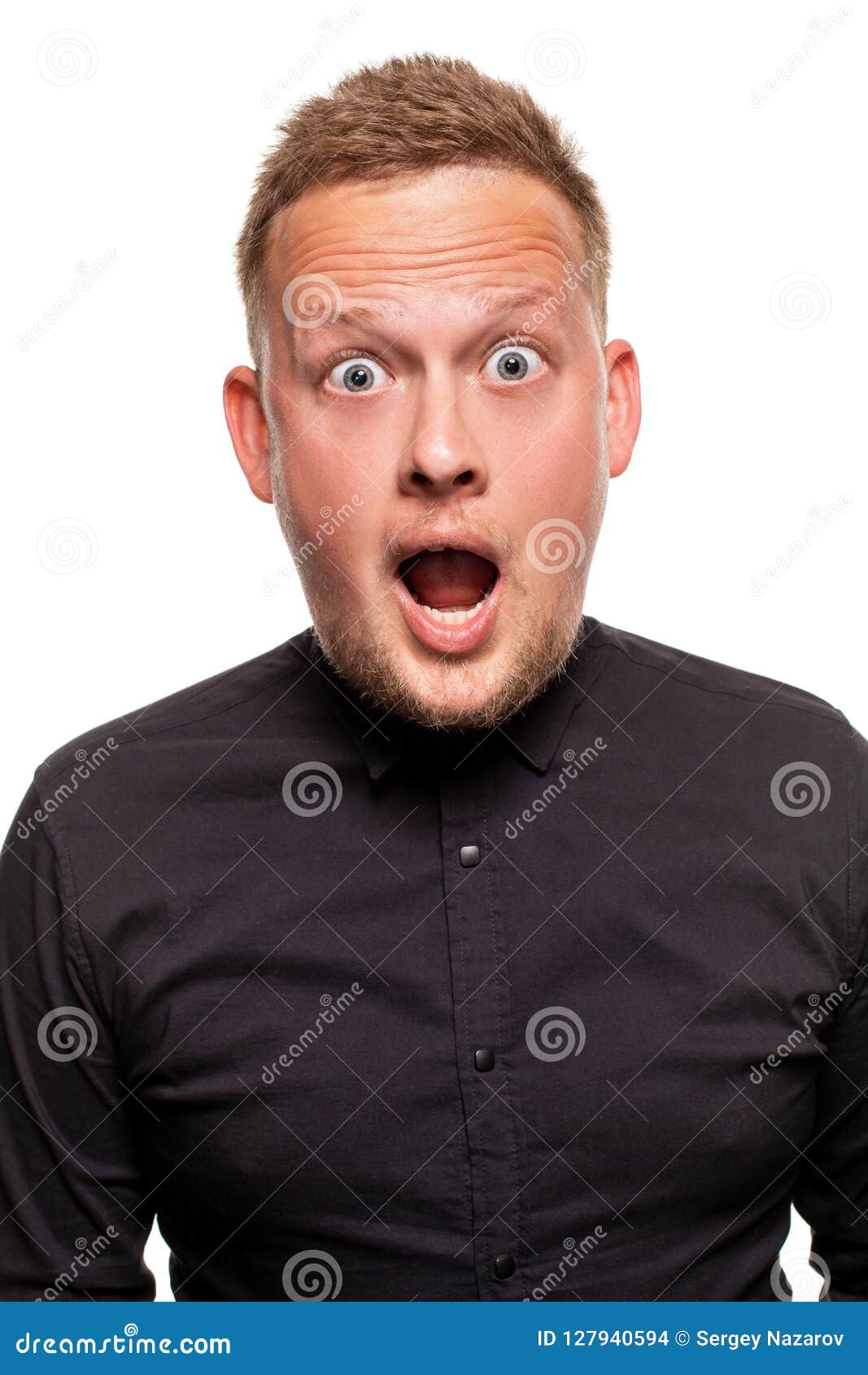 Vertical Shot of Stupefied Stunned Shocked Young Male Keeps Mouth ... Vertical Shot of Stupefied Stunned Shocked Young Male Keeps Mouth ...