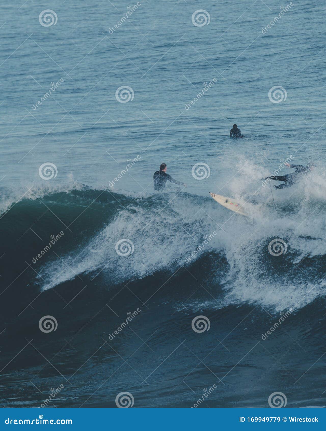 Vertical Shot of Surfers Falling Form Their Boards on the Wave ...