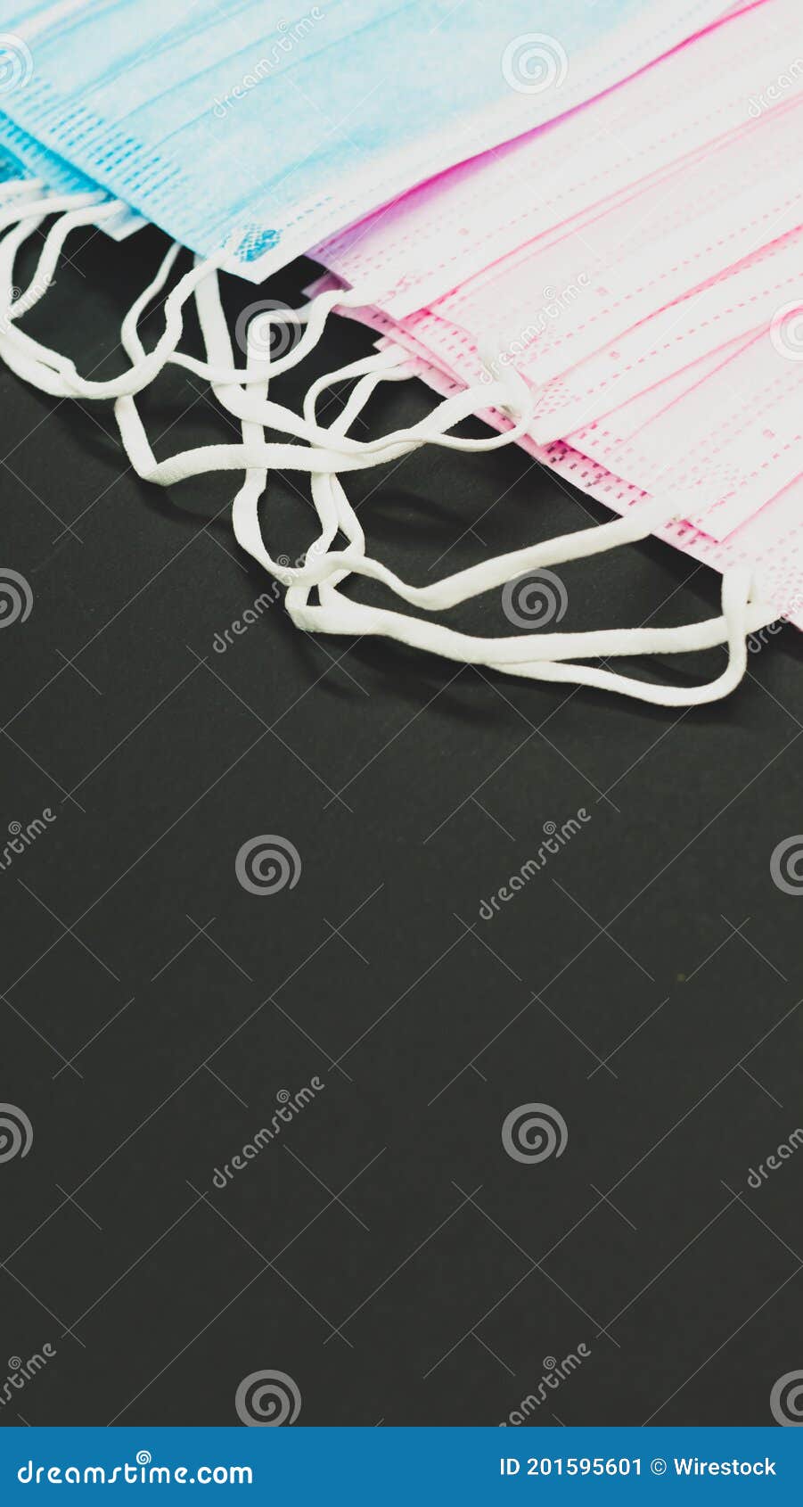 Vertical Shot of Surgical Masks on a Black Surface Stock Image - Image ...