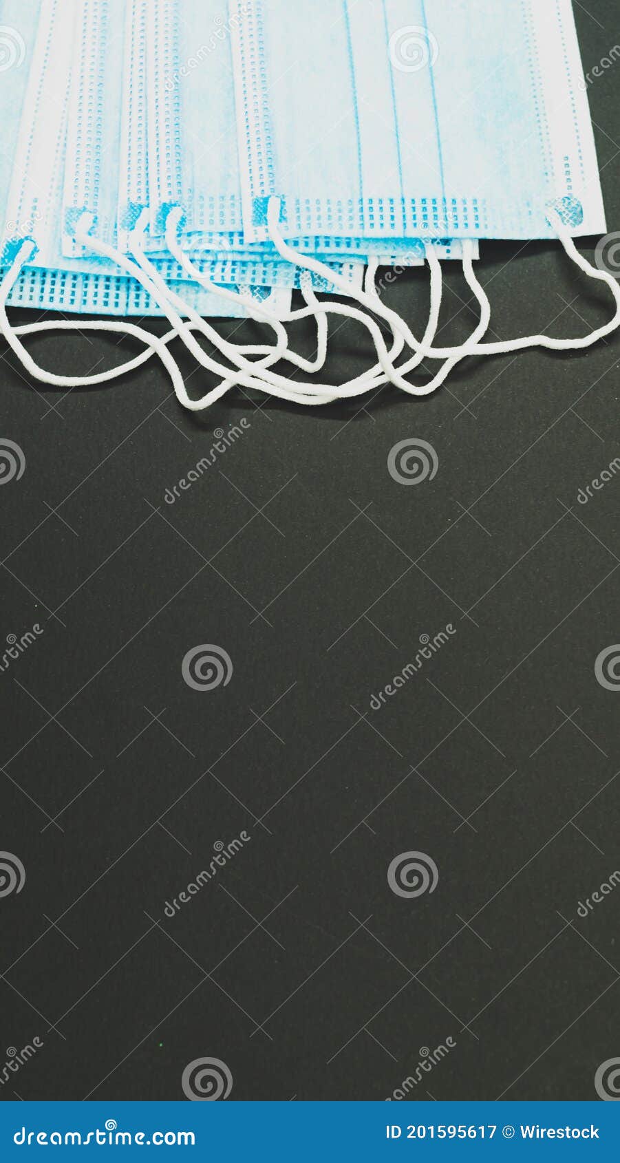 Vertical Shot of Surgical Masks on a Black Surface Stock Image - Image ...