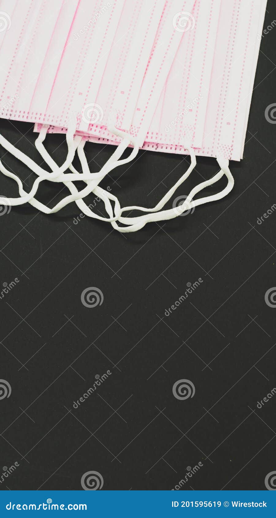 Vertical Shot of Surgical Masks on a Black Surface Stock Image - Image ...
