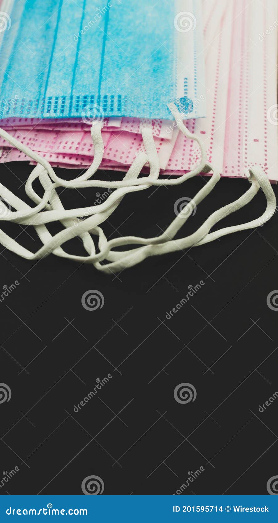 Vertical Shot of Surgical Masks on a Black Surface Stock Photo - Image ...
