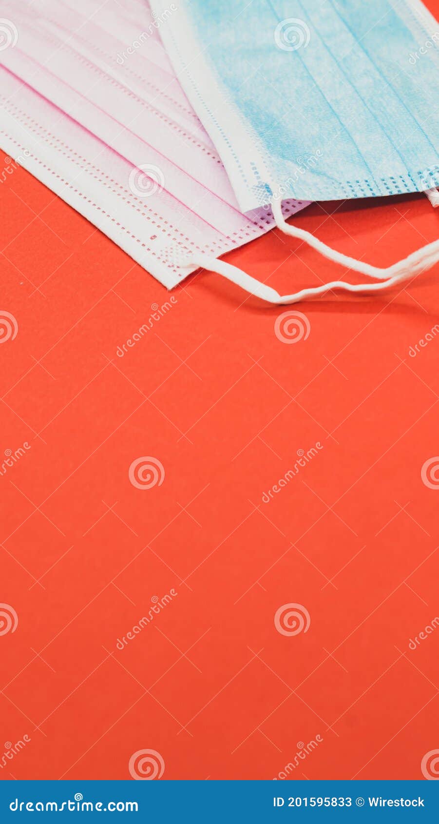 Vertical Shot of Surgical Masks on a Red Surface Stock Image - Image of ...