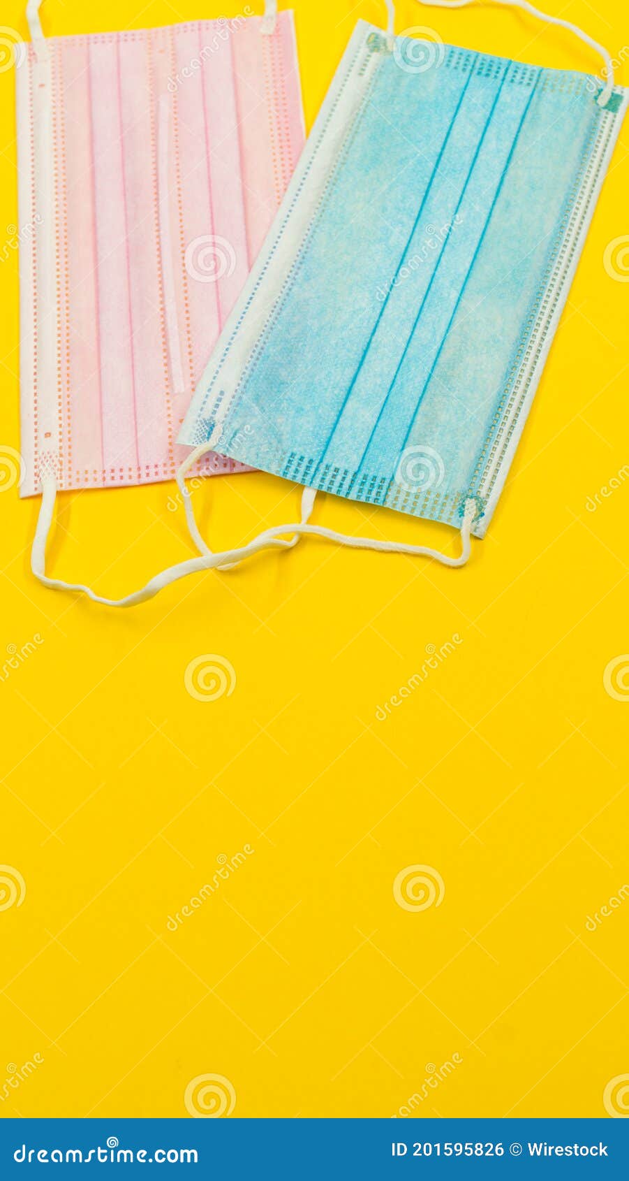 Vertical Shot of Surgical Masks on a Yellow Surface Stock Photo - Image ...