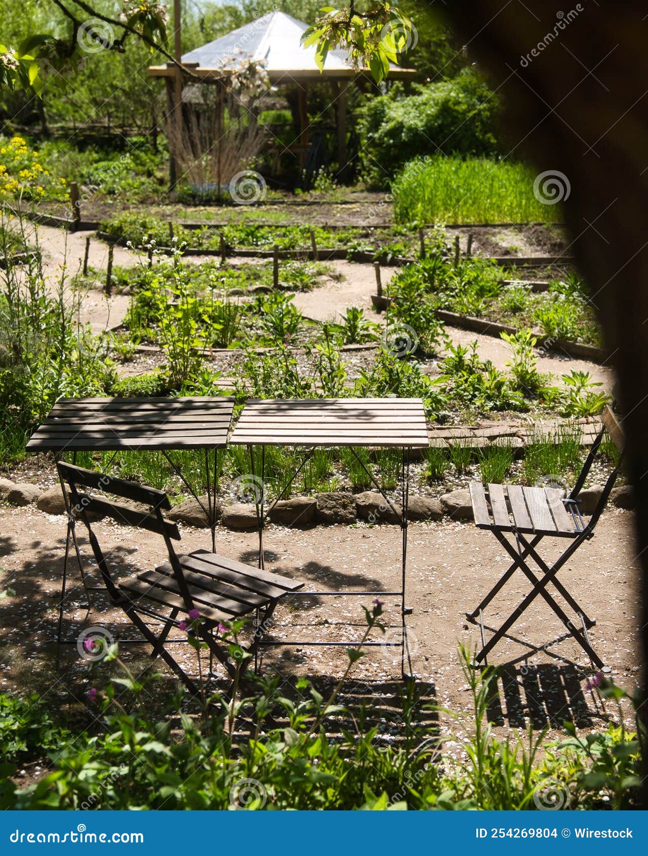 Vertical Shot of Tables with Two Chairs in a Park Stock Photo - Image ...