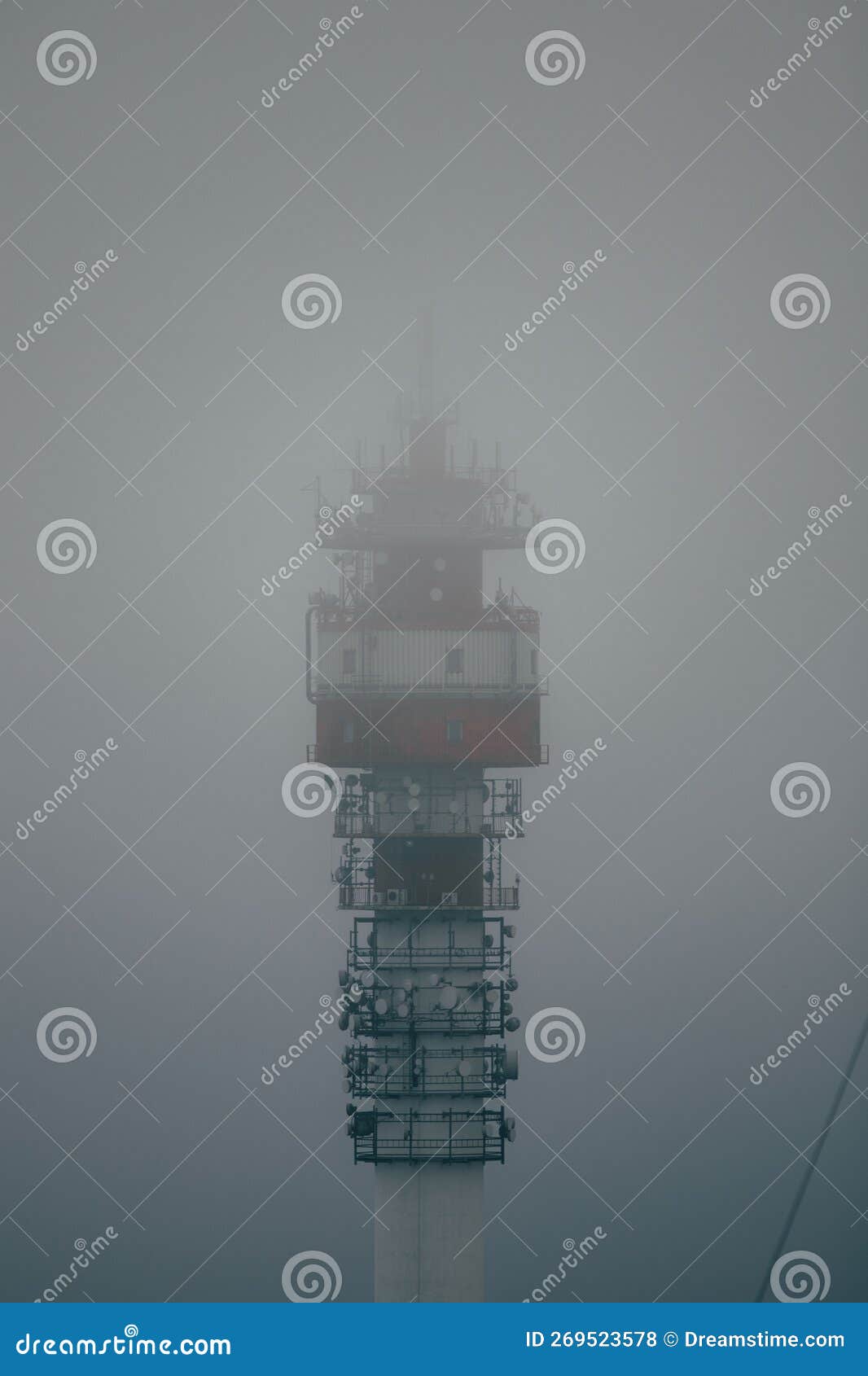 Vertical Shot of a Telecommunication Tower Covered in Fog Stock Photo ...