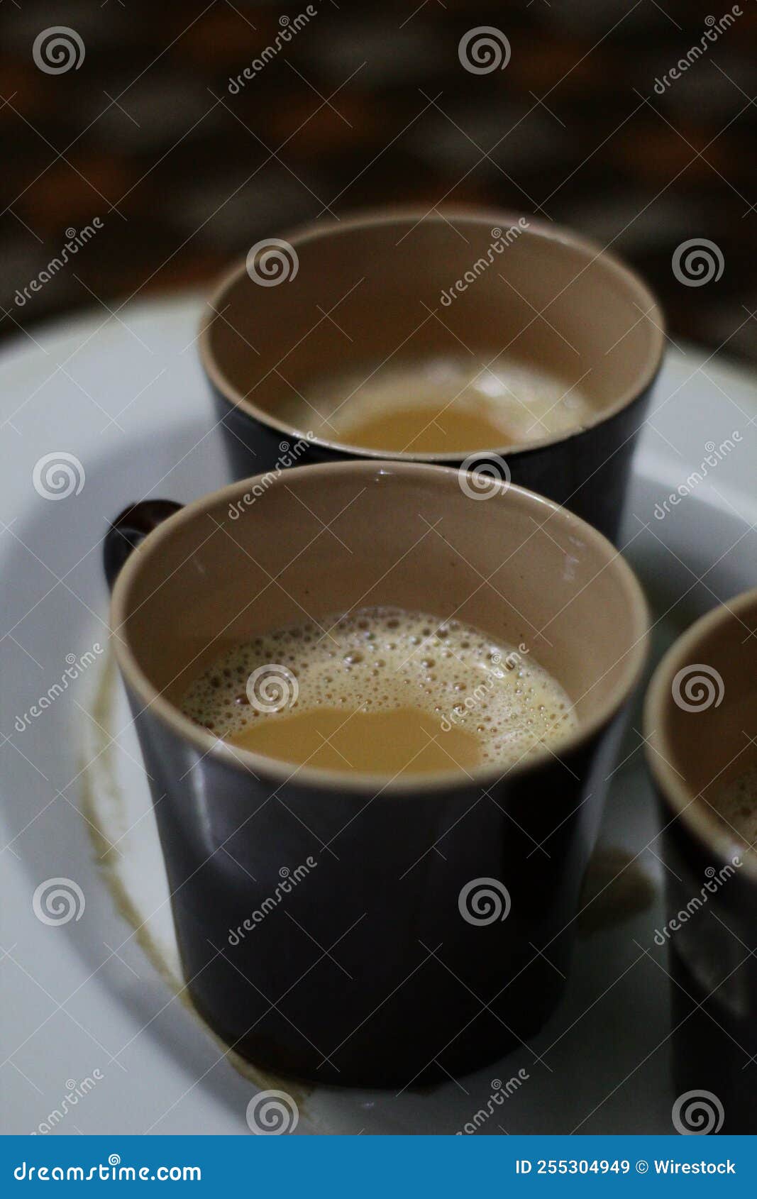 Vertical Shot of Three Coffee Mugs in a Tray. Stock Image - Image of ...