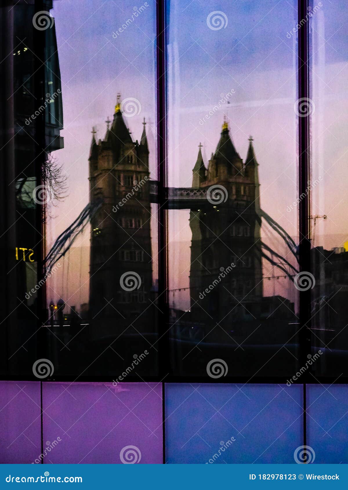 Vertical Shot of Tower Bridge Reflection in the Glass Building in ...