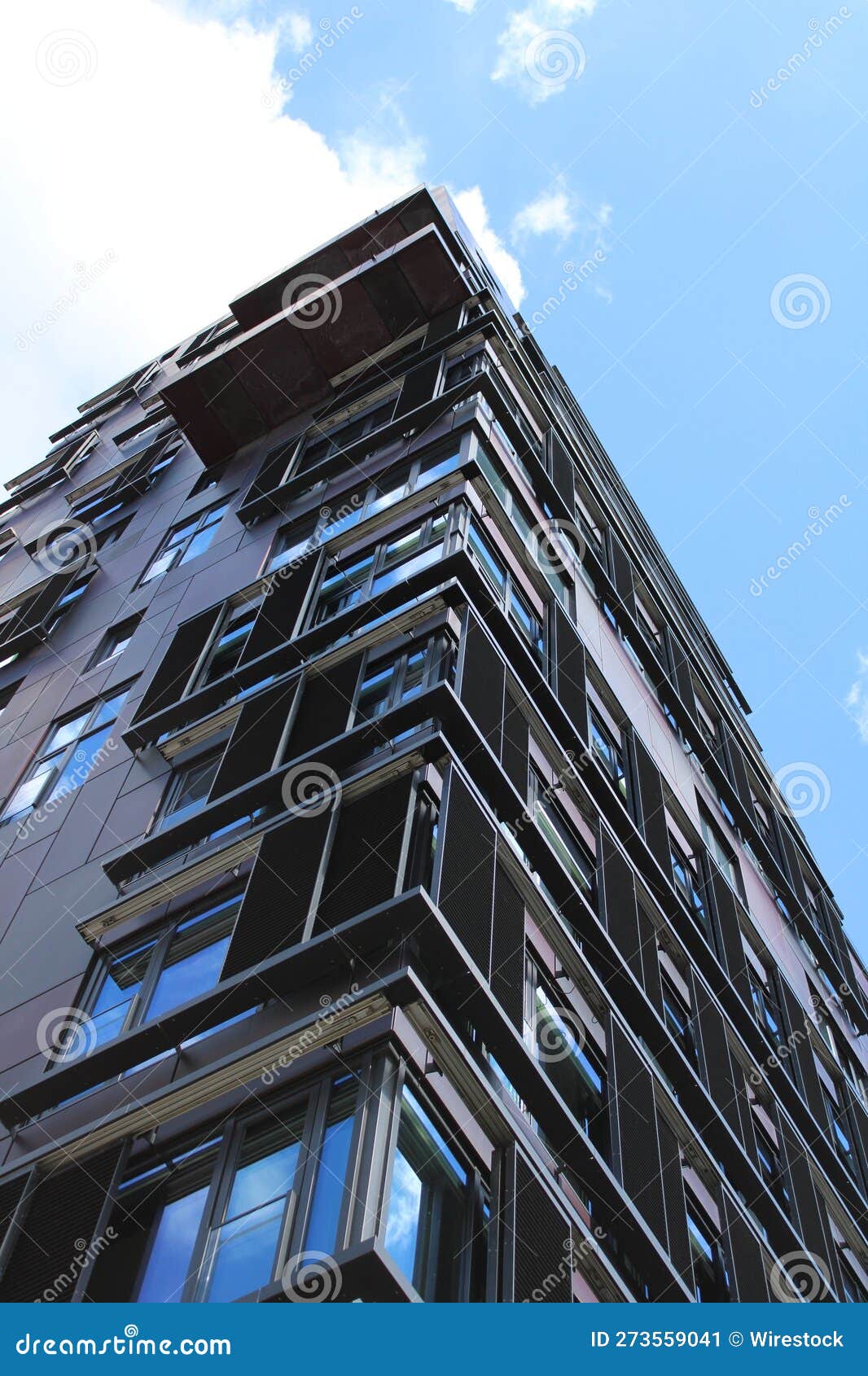 Vertical Shot of Towering Skyscraper is Seen Against the Cloudy ...