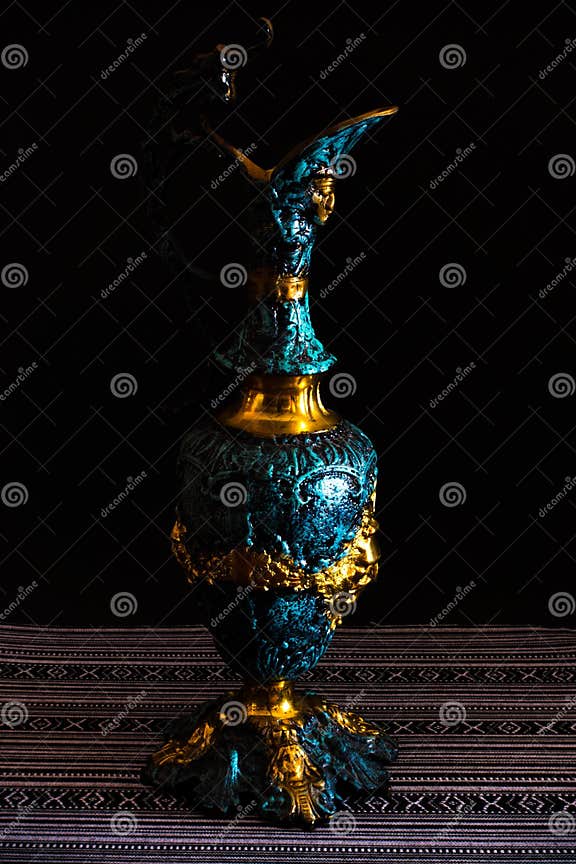 Vertical Shot of a Traditionally Decorated Pitcher on a Black ...
