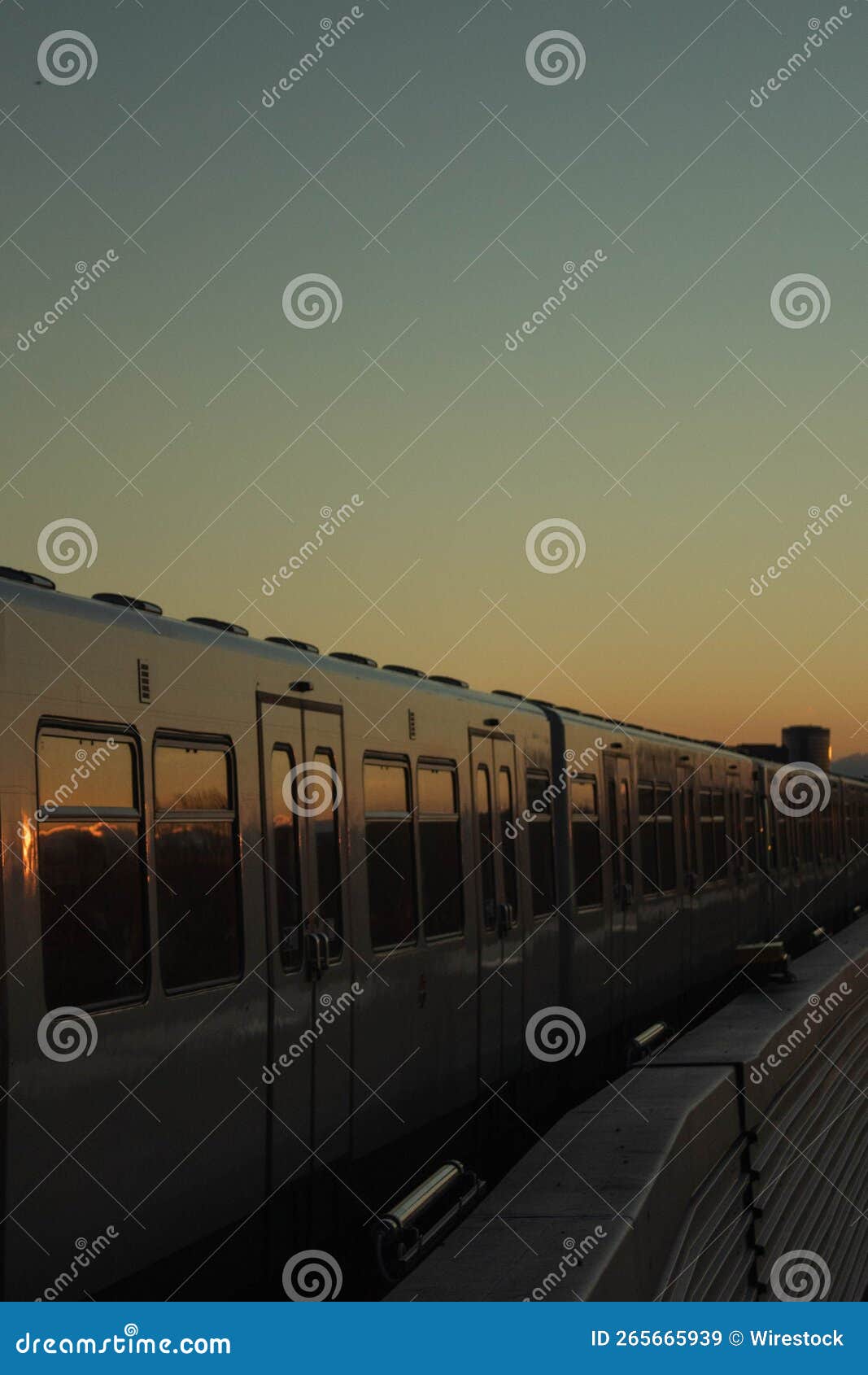 Vertical Shot of a Train at the Platform at a Beautiful Calm Sunset ...