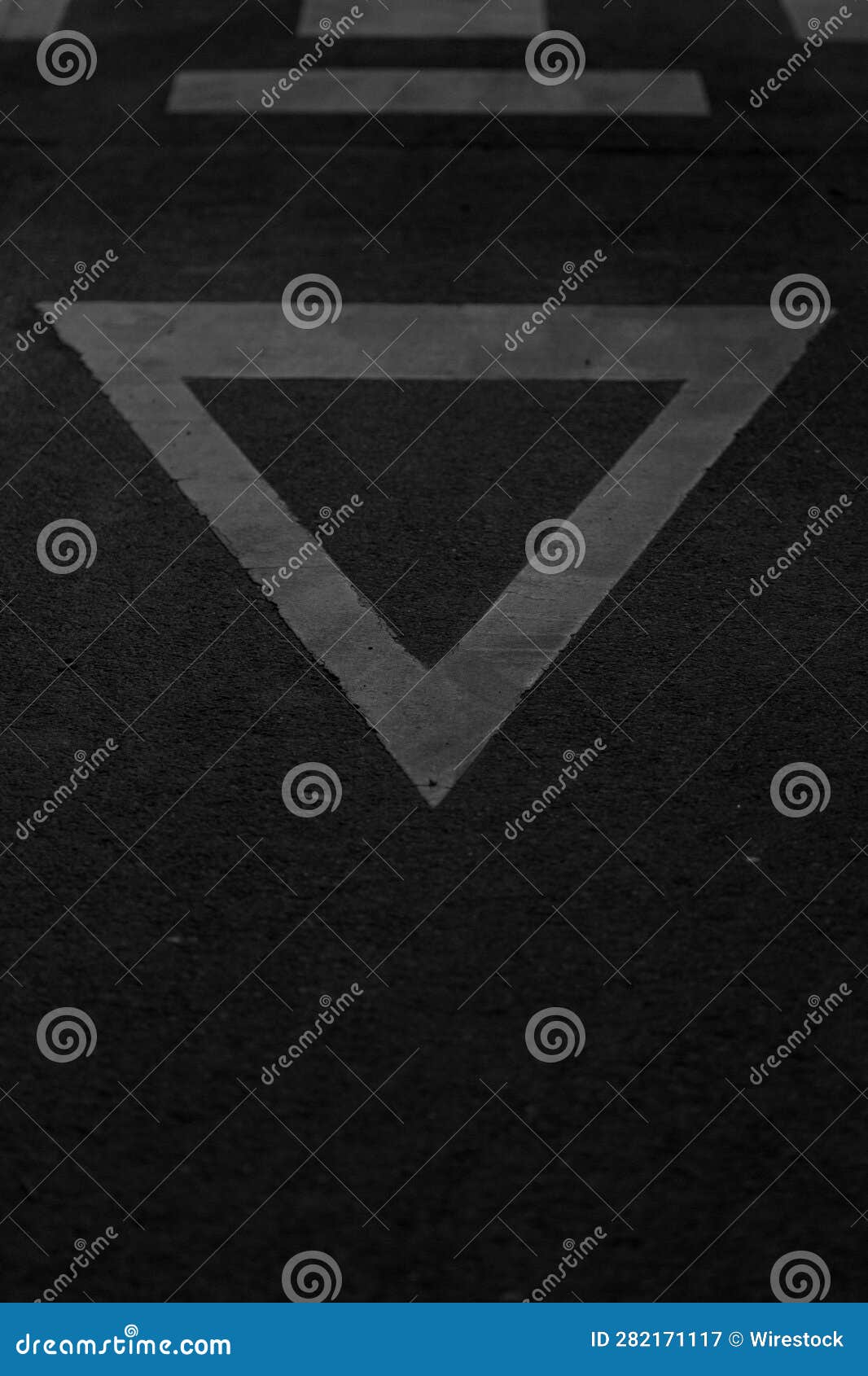 Vertical Shot of a Triangle Shaped Road Sign on the Asphalt Stock Image ...