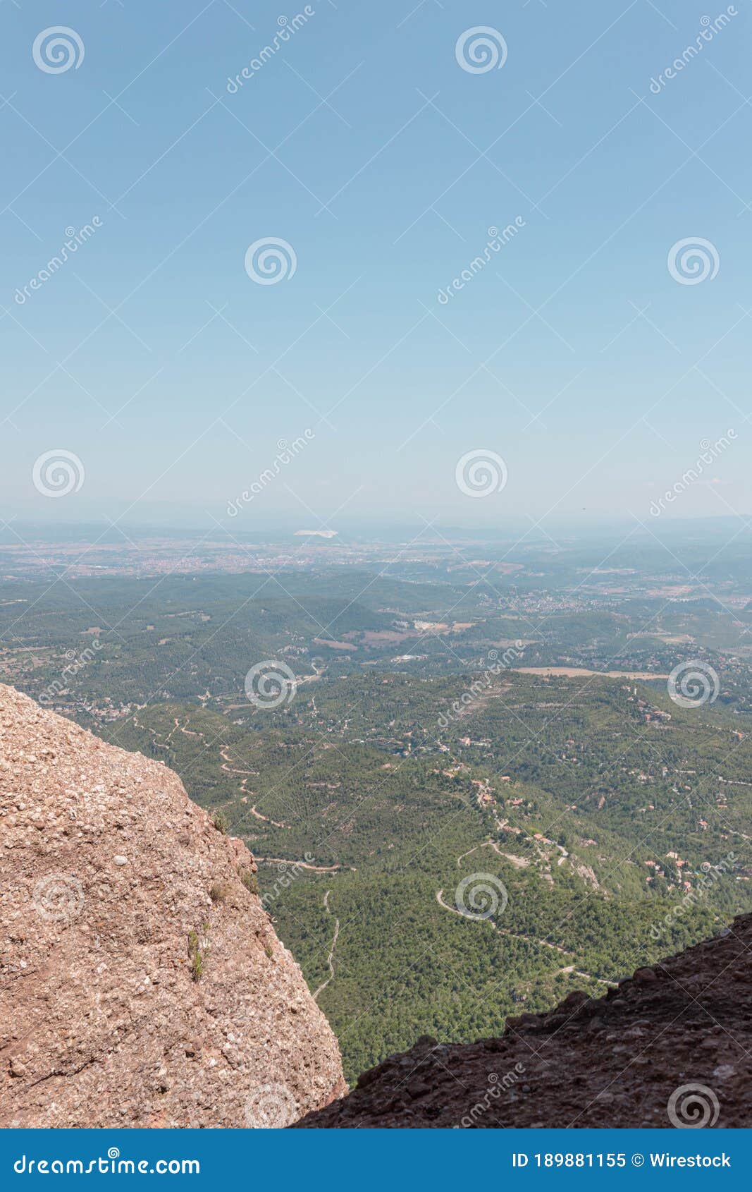 Vertical Shot of Two High Cliffs with Forest in the Background Stock ...