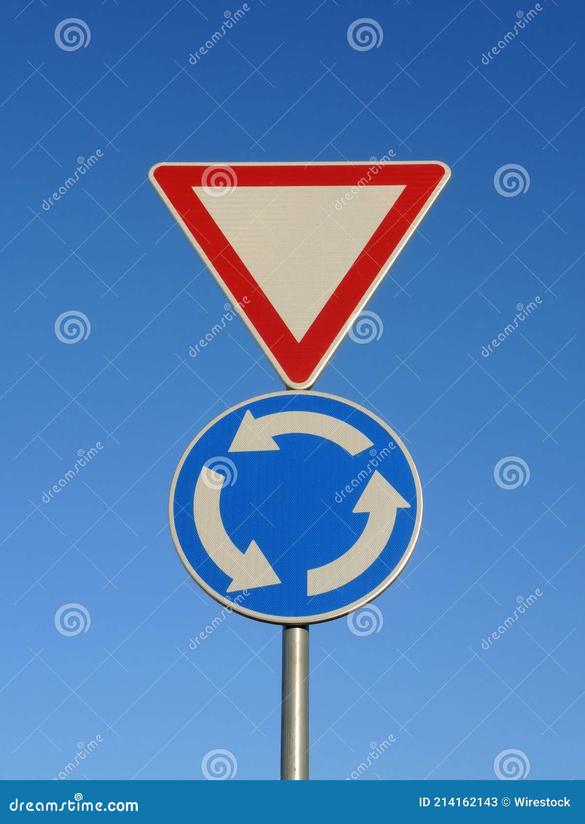 A Vertical Shot of Two Traffic Signs on the Same Post - Give Way and ...