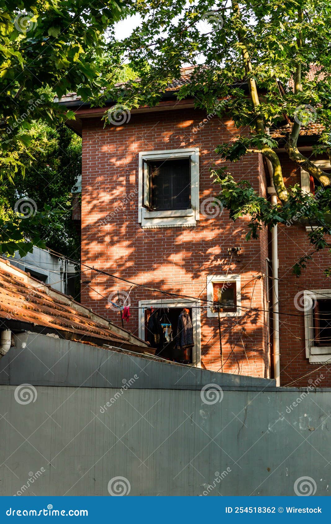 Vertical Shot of a Typical Brick House in Shanghai with Greenery ...