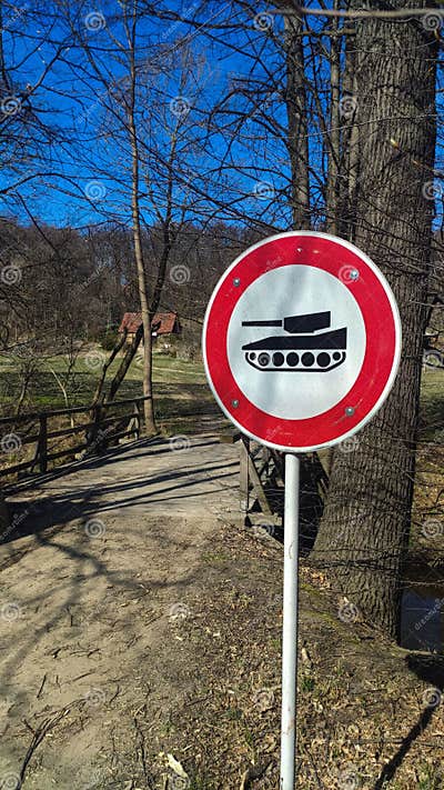Vertical Shot of a Warning Sign with a Tank Stock Image - Image of ...