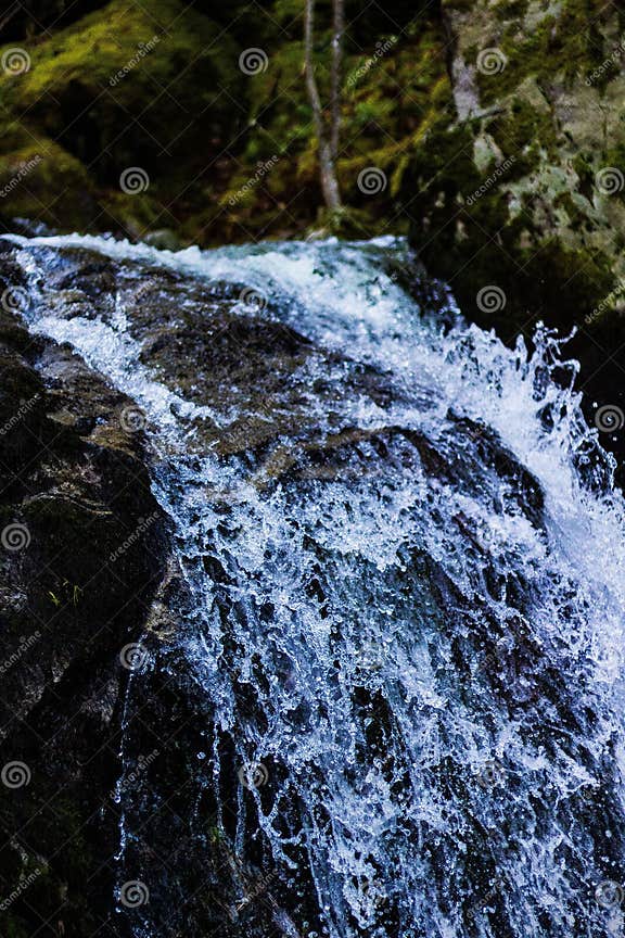 Vertical Shot of Water Flows on Rocks Stock Image - Image of rocks ...