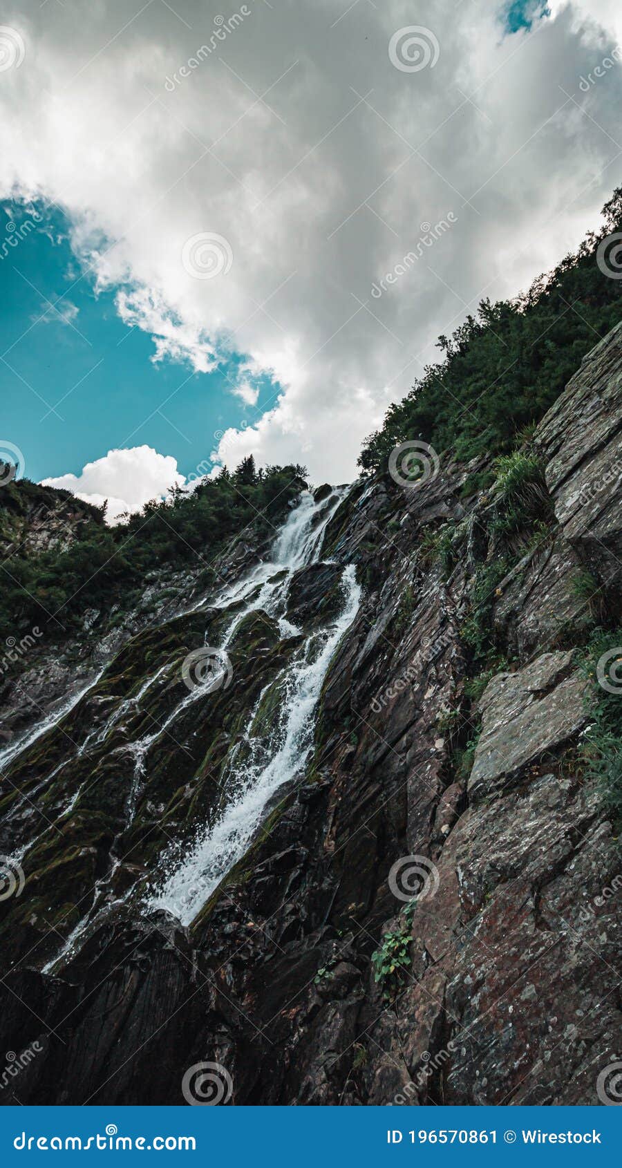 Vertical Shot of a Waterfall Cascading Down Stock Image - Image of ...