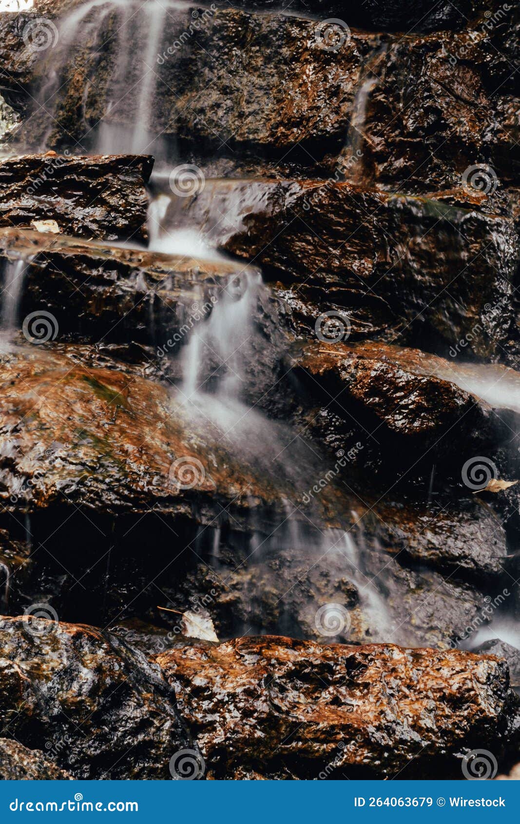 Vertical Shot of Waterfall Cascading Over the Rocks Stock Image - Image ...