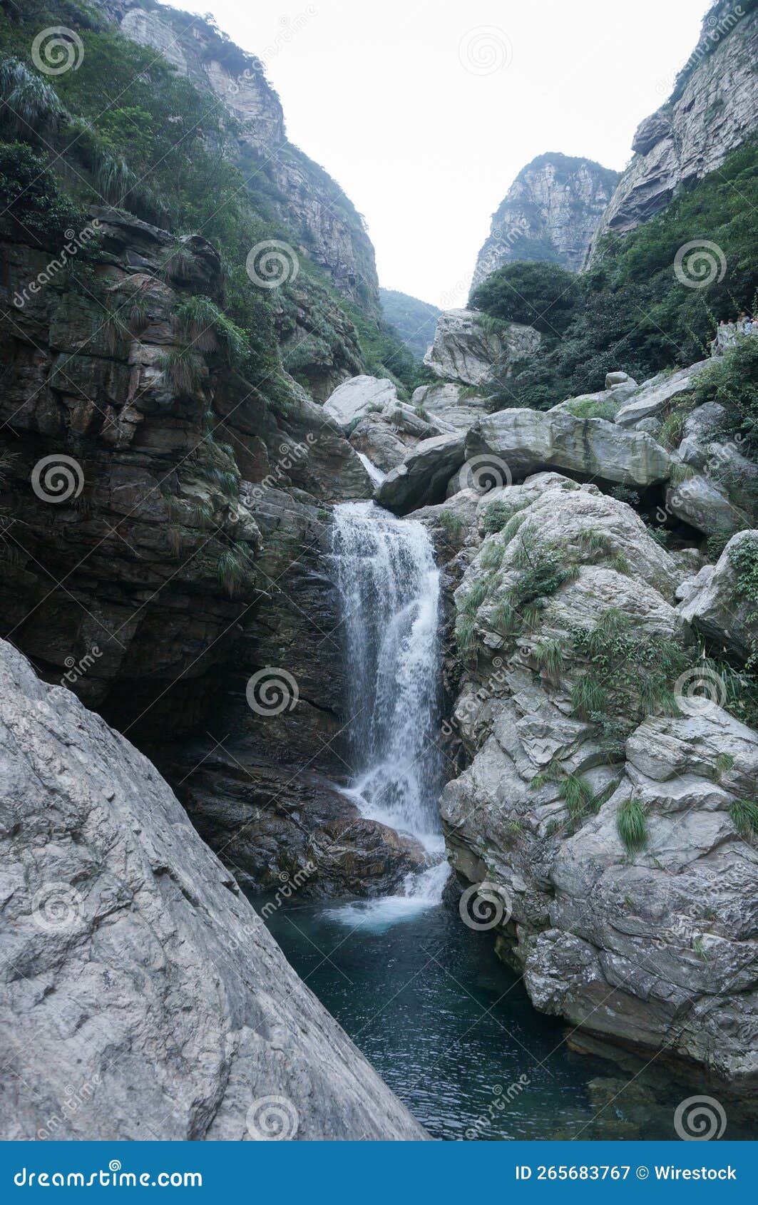 Vertical Shot of a Waterfall Falling Down the Rocks. Stock Image ...