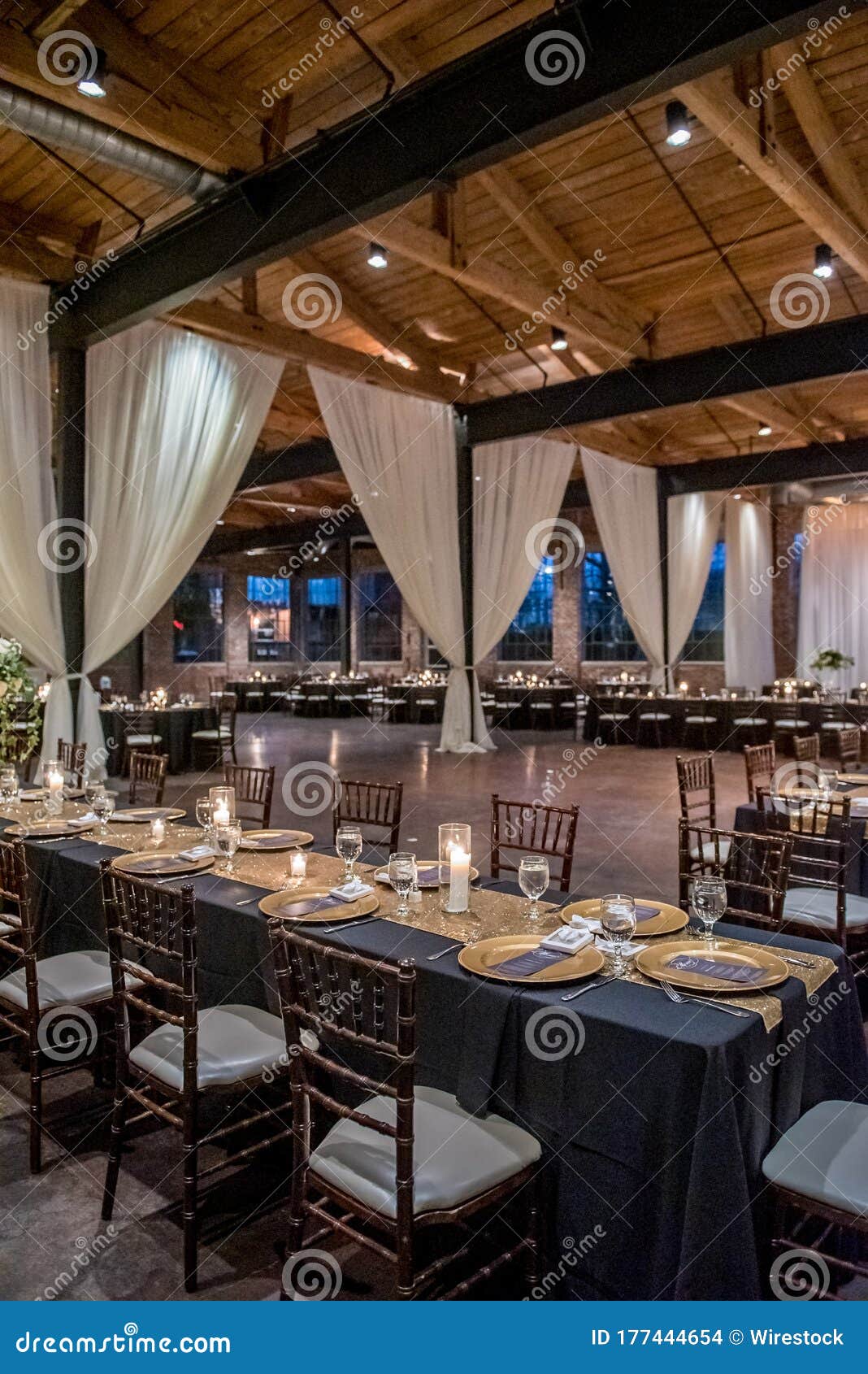 Vertical Shot of a Wedding Hall with Elegant Table Setting Stock Photo ...