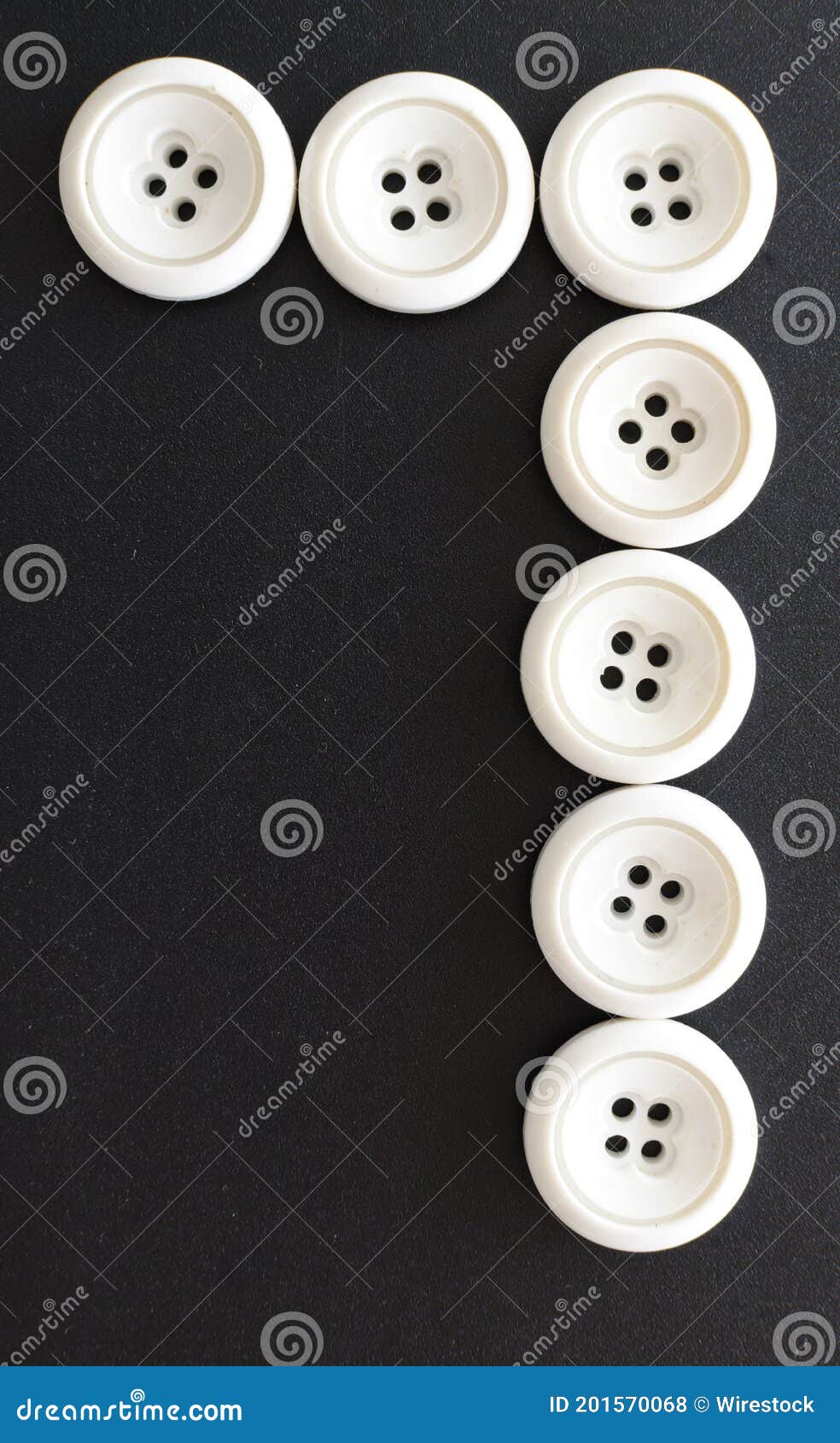 Vertical Shot of White Buttons Assorted Like the Number Seven on a ...